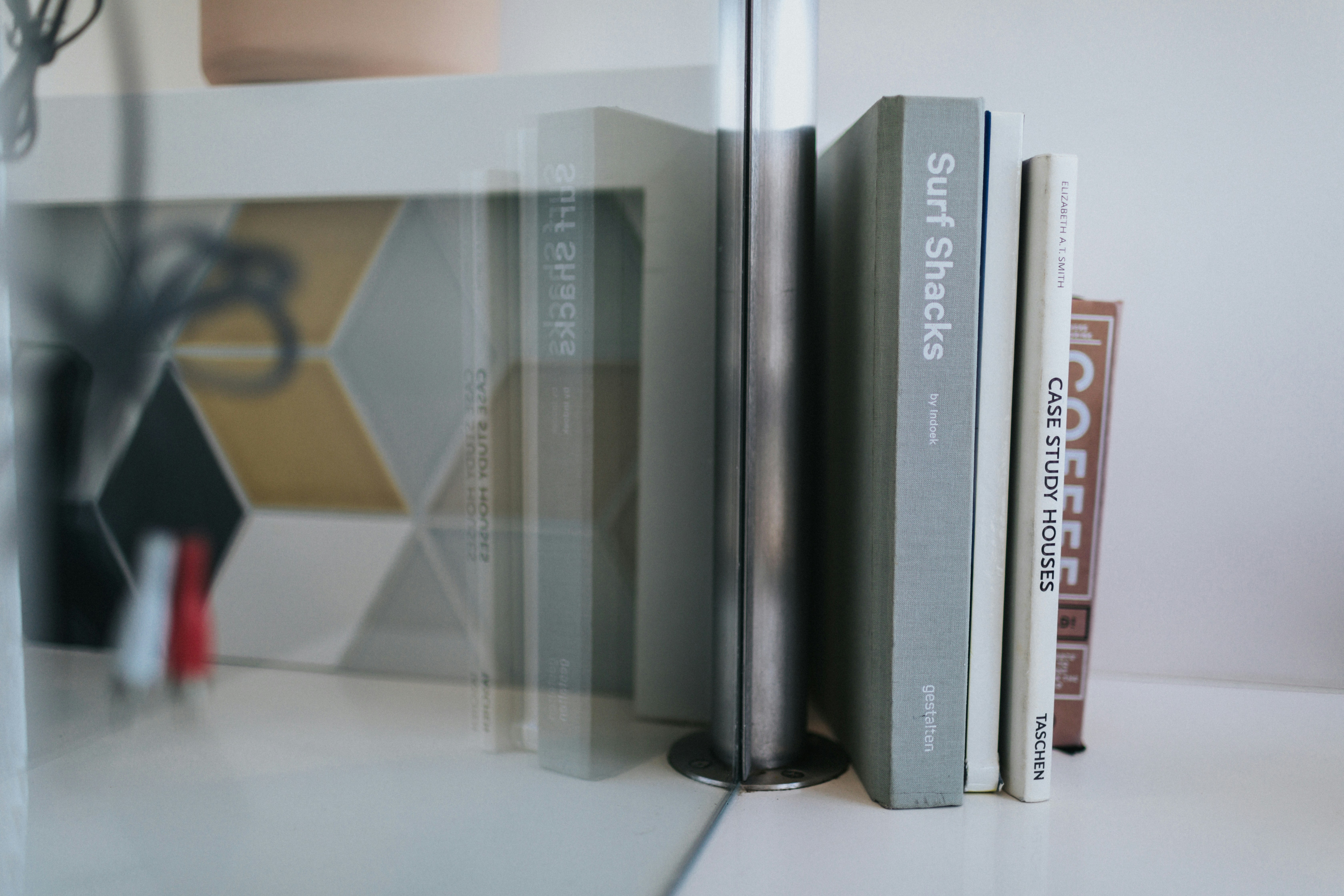 Black and red books on white shelf photo – Free Book Image on Unsplash