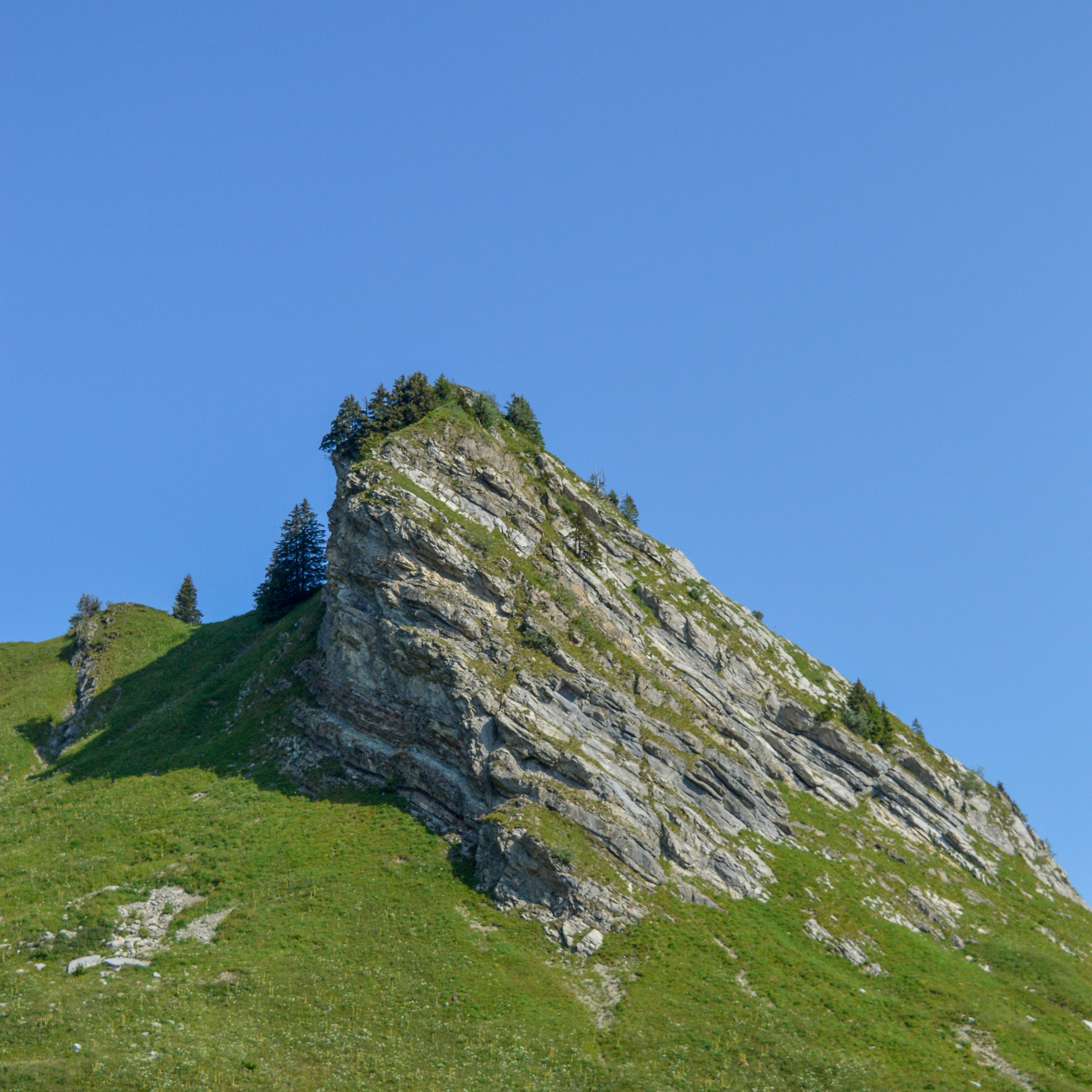 Green and gray rocky mountain under blue sky during daytime photo ...
