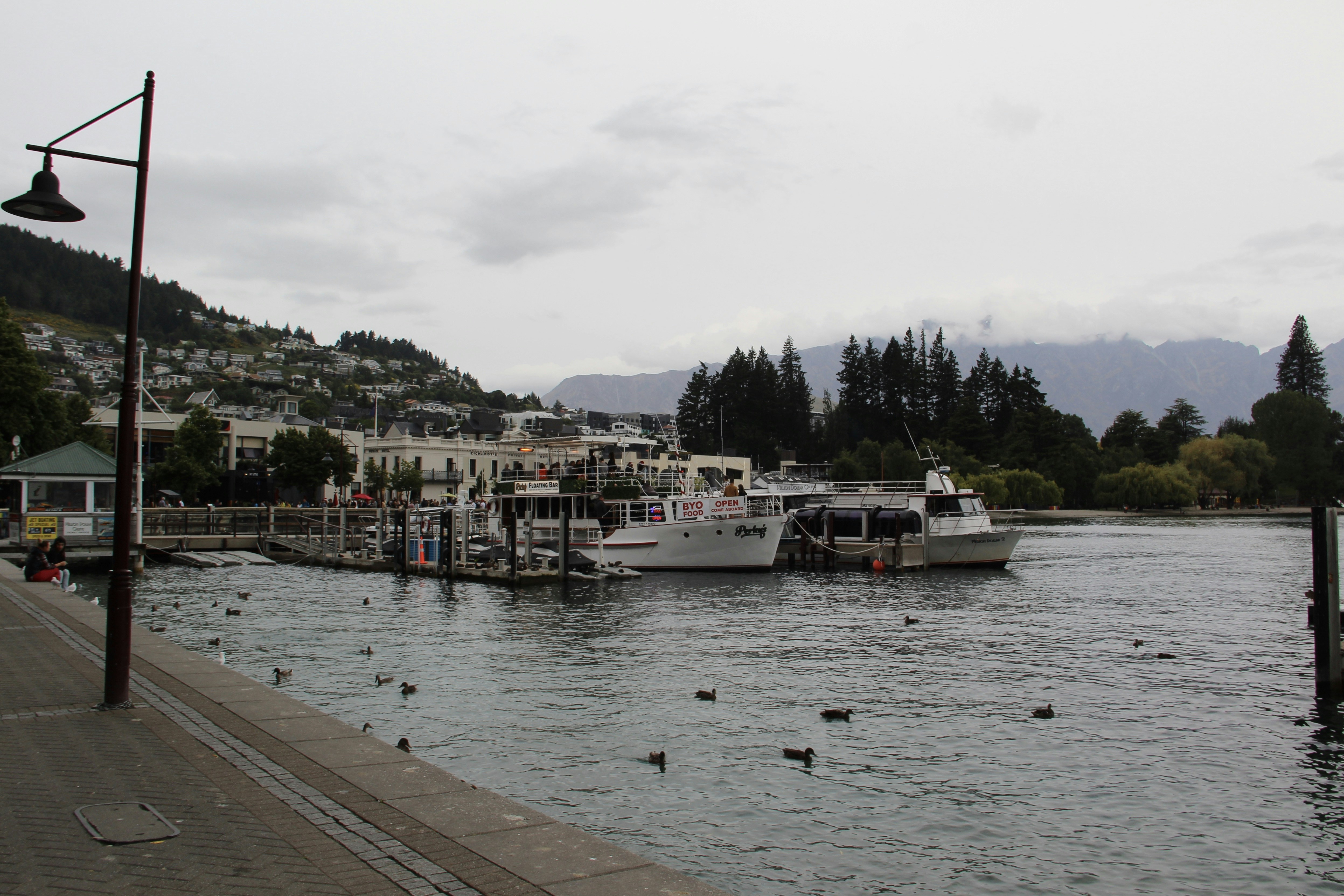 Harbor Promenade at Daybreak: Boats, Docks, and a Tranquil Waterfront