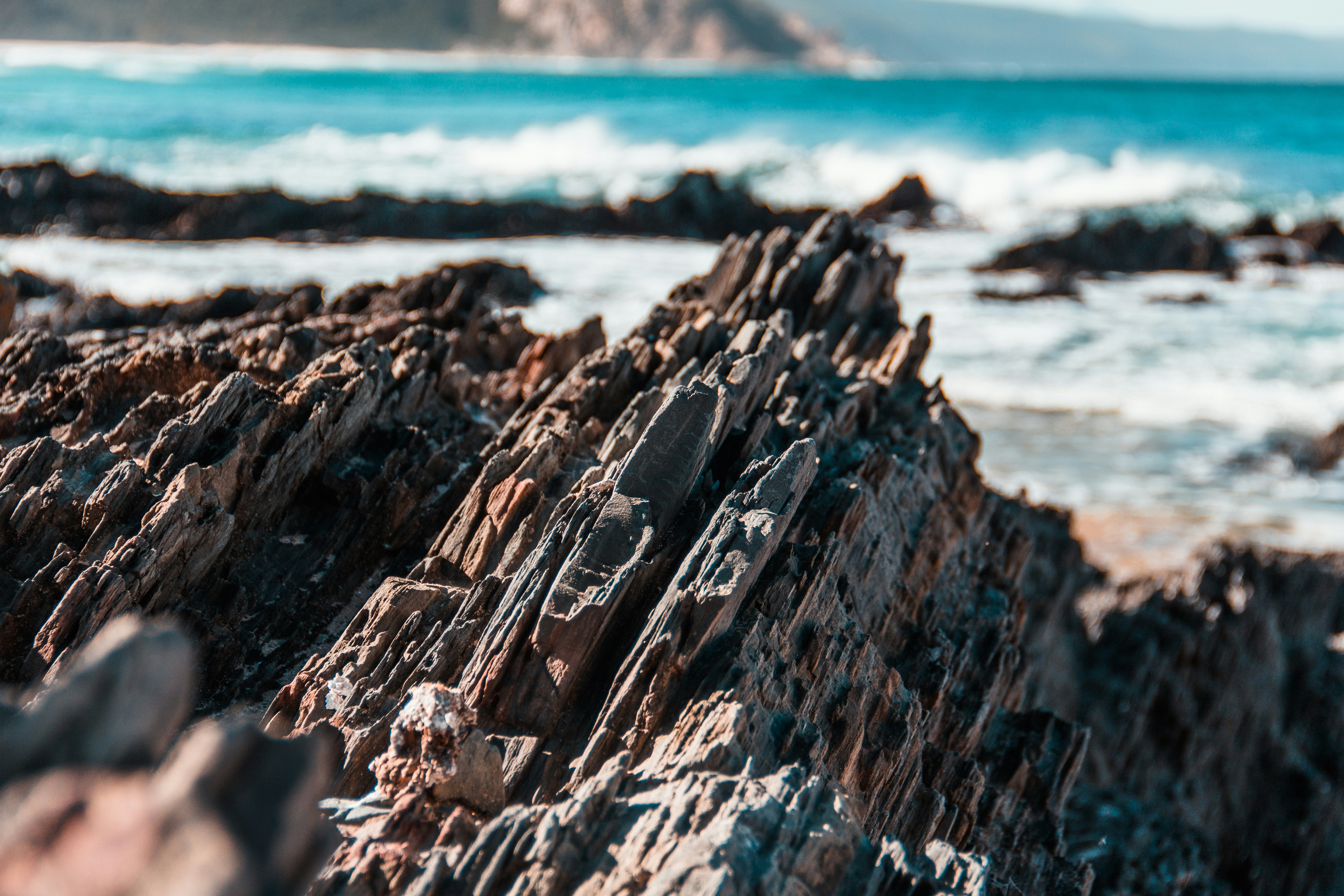 Strata at the Break: Jagged Rock Ridge Meeting the Sea