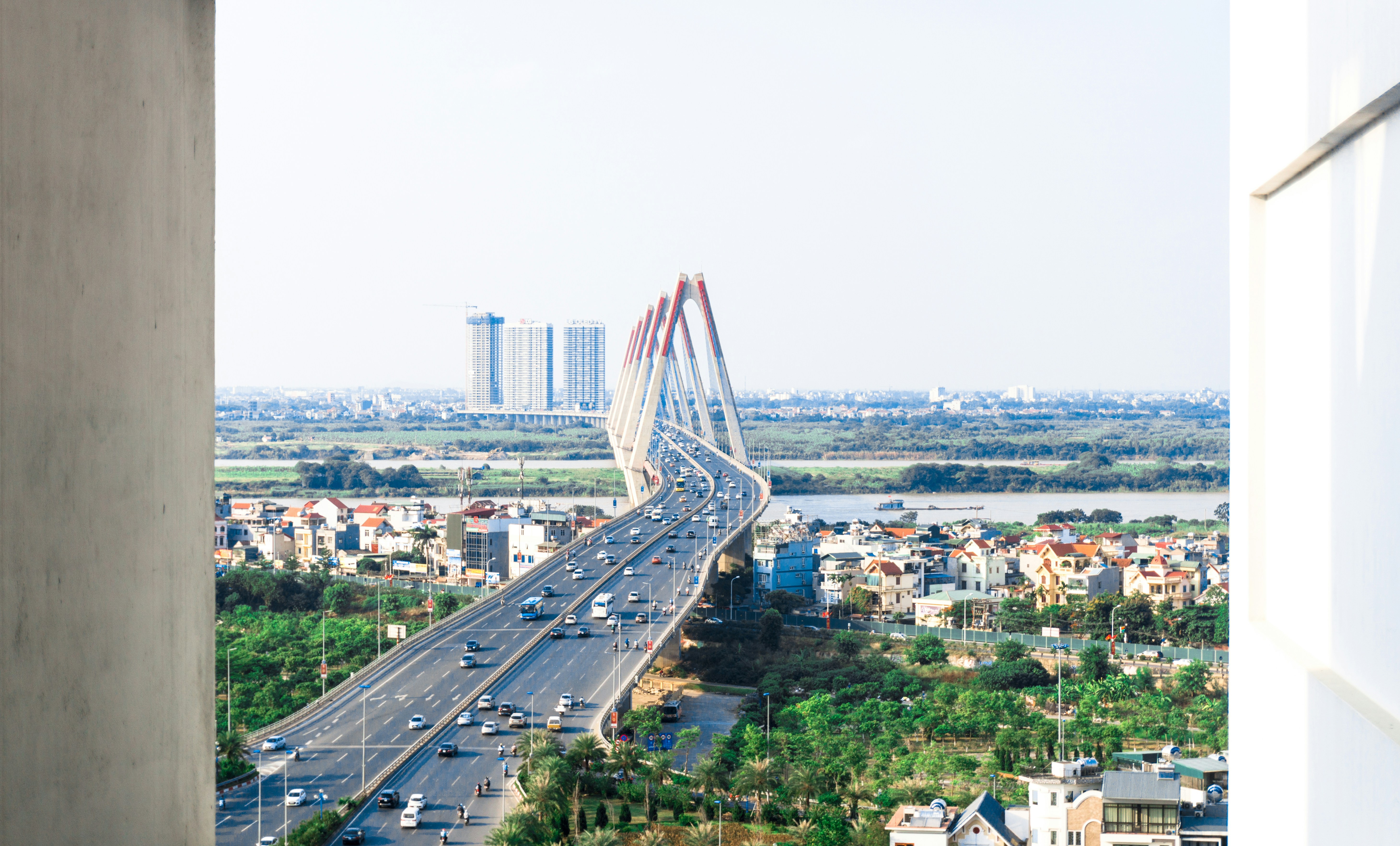Red-Capped Arch Bridge Framing the Suburban Delta Highway