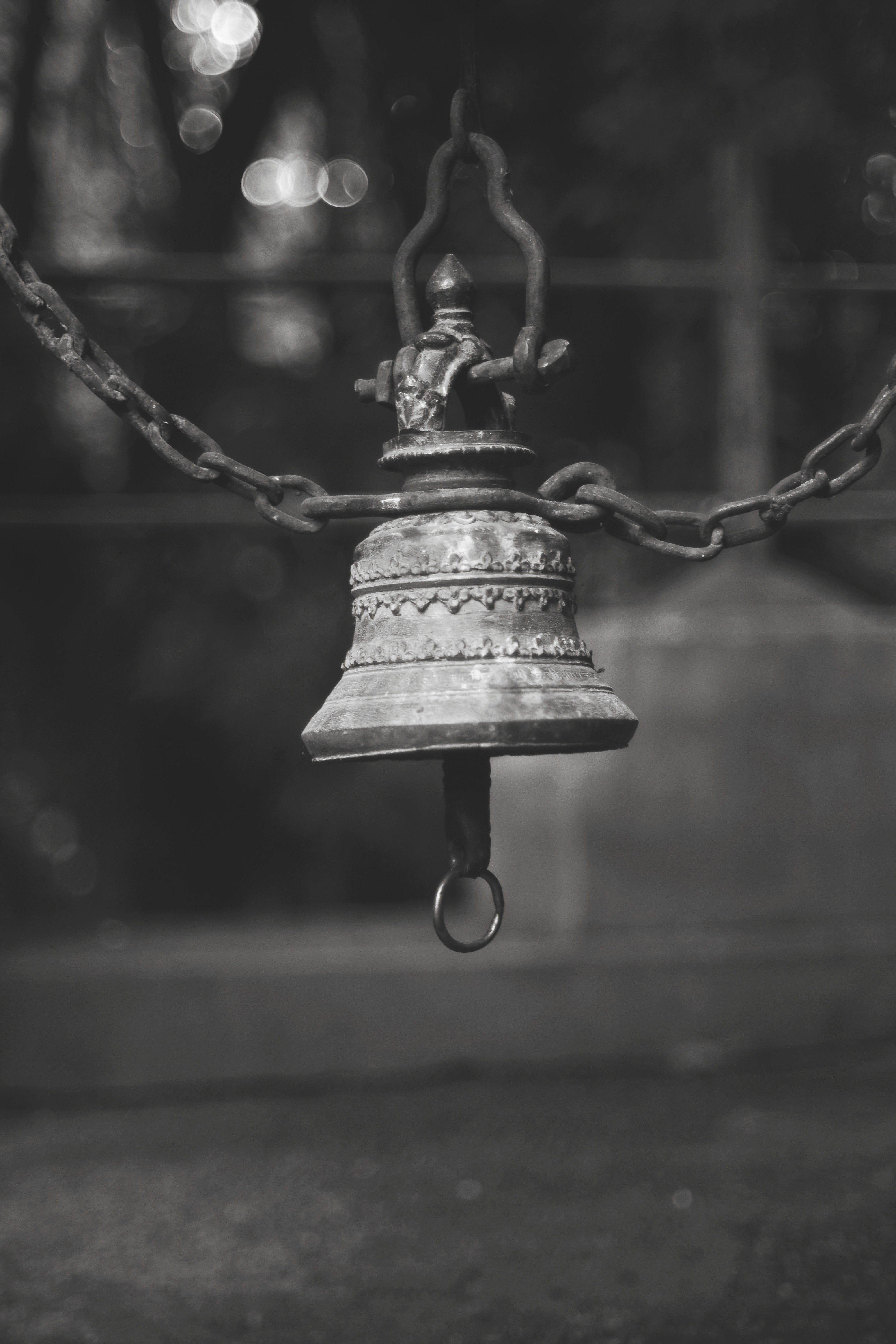 Gray bell hanging on black metal wire photo – Free Grey Image on Unsplash