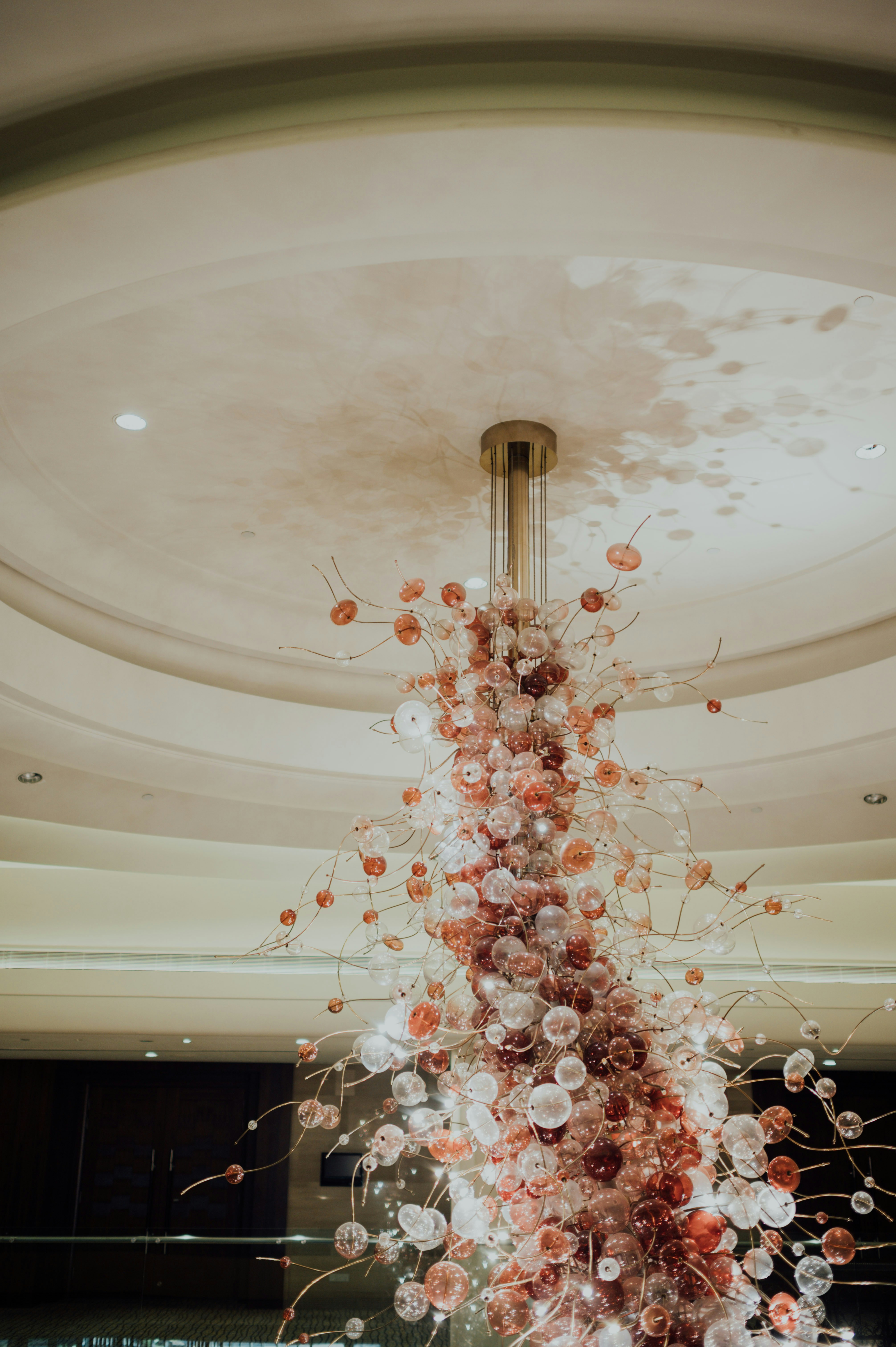 Suspended Glass Blossom: An Enchanting Centerpiece in Soft Ambient Light