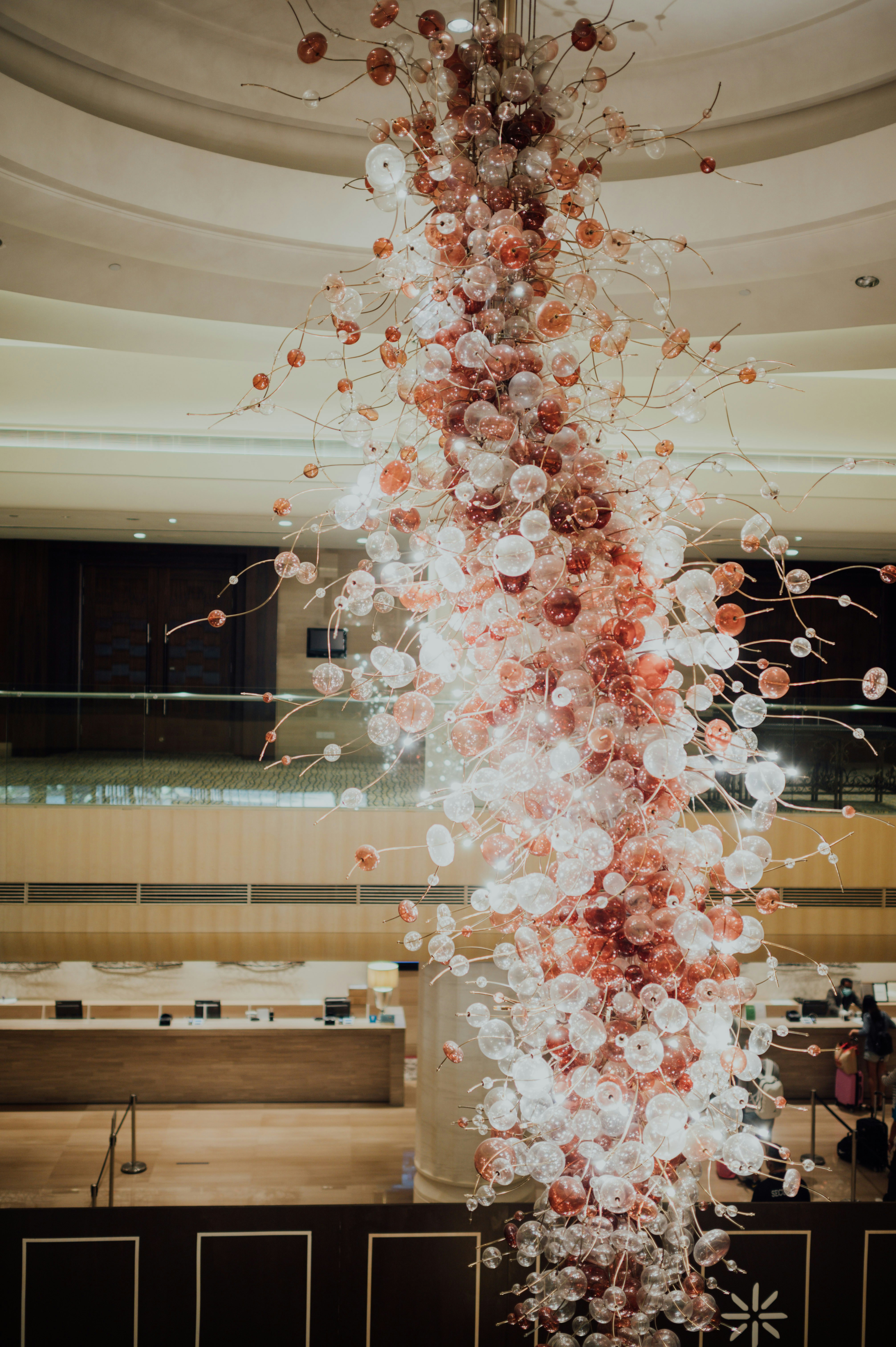 Crystal Cascade: a suspended sculpture rising through a grand hotel lobby