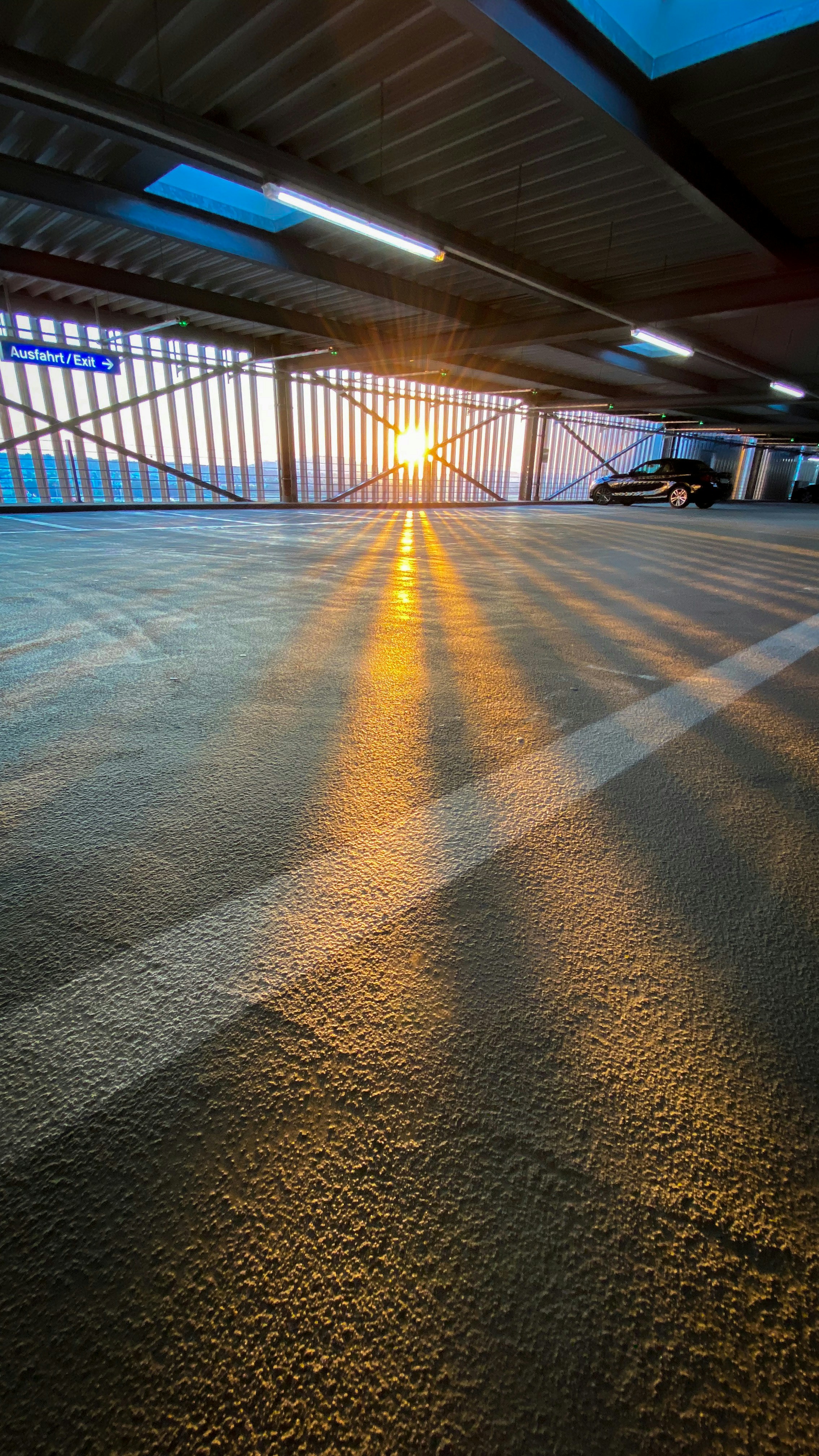Golden Convergence: Sunburst Through a Parking-Garage Grid