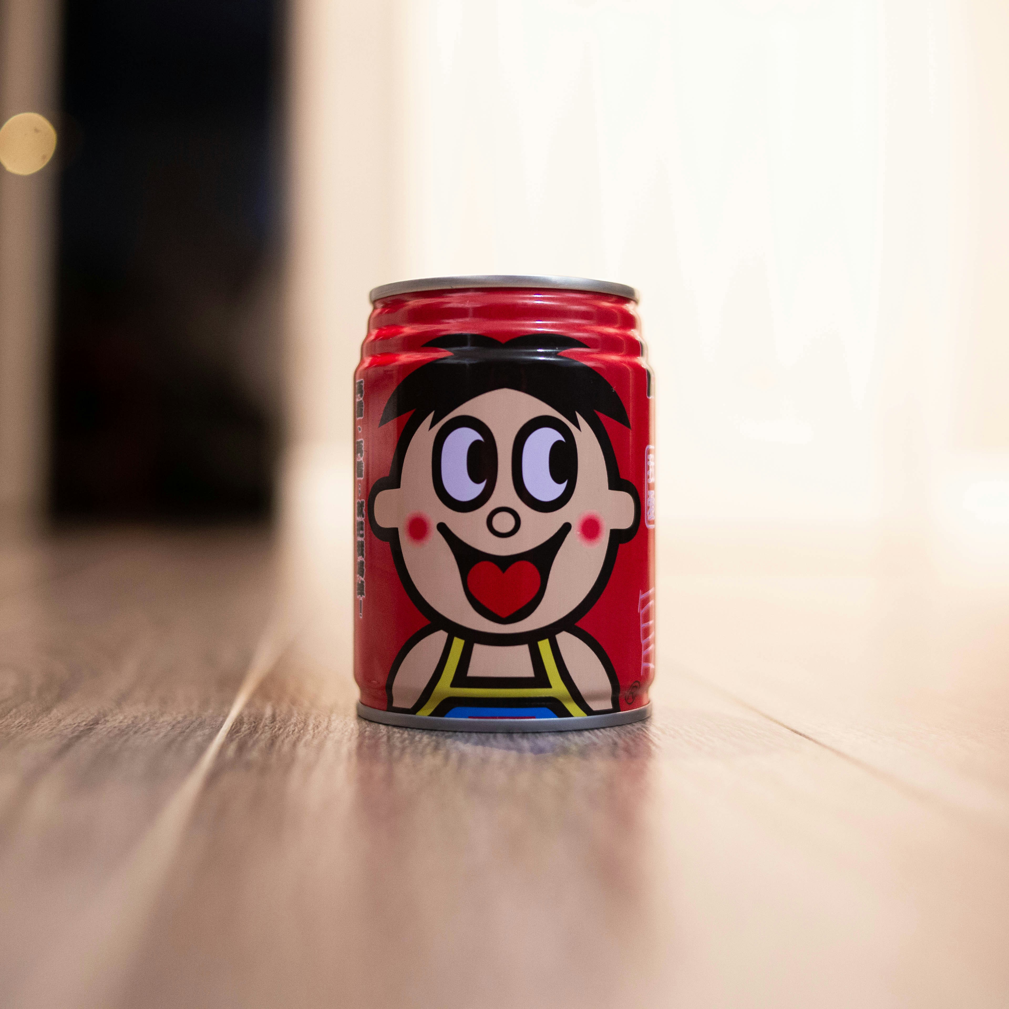 Capsule of Smile: Red Can on a Wooden Stage