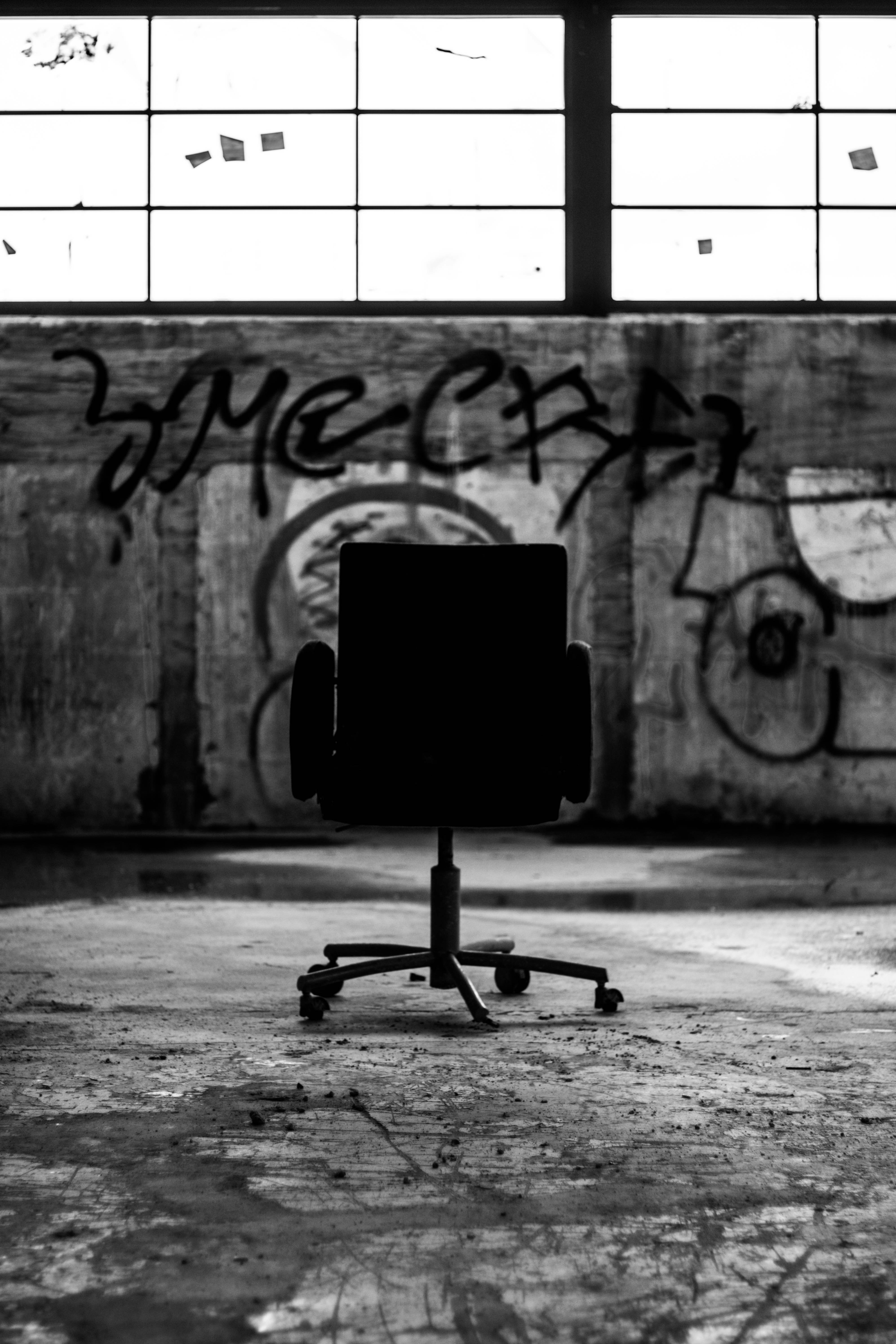 Chair in an Urban Ghost: A Black-and-White Study of Abandoned Space