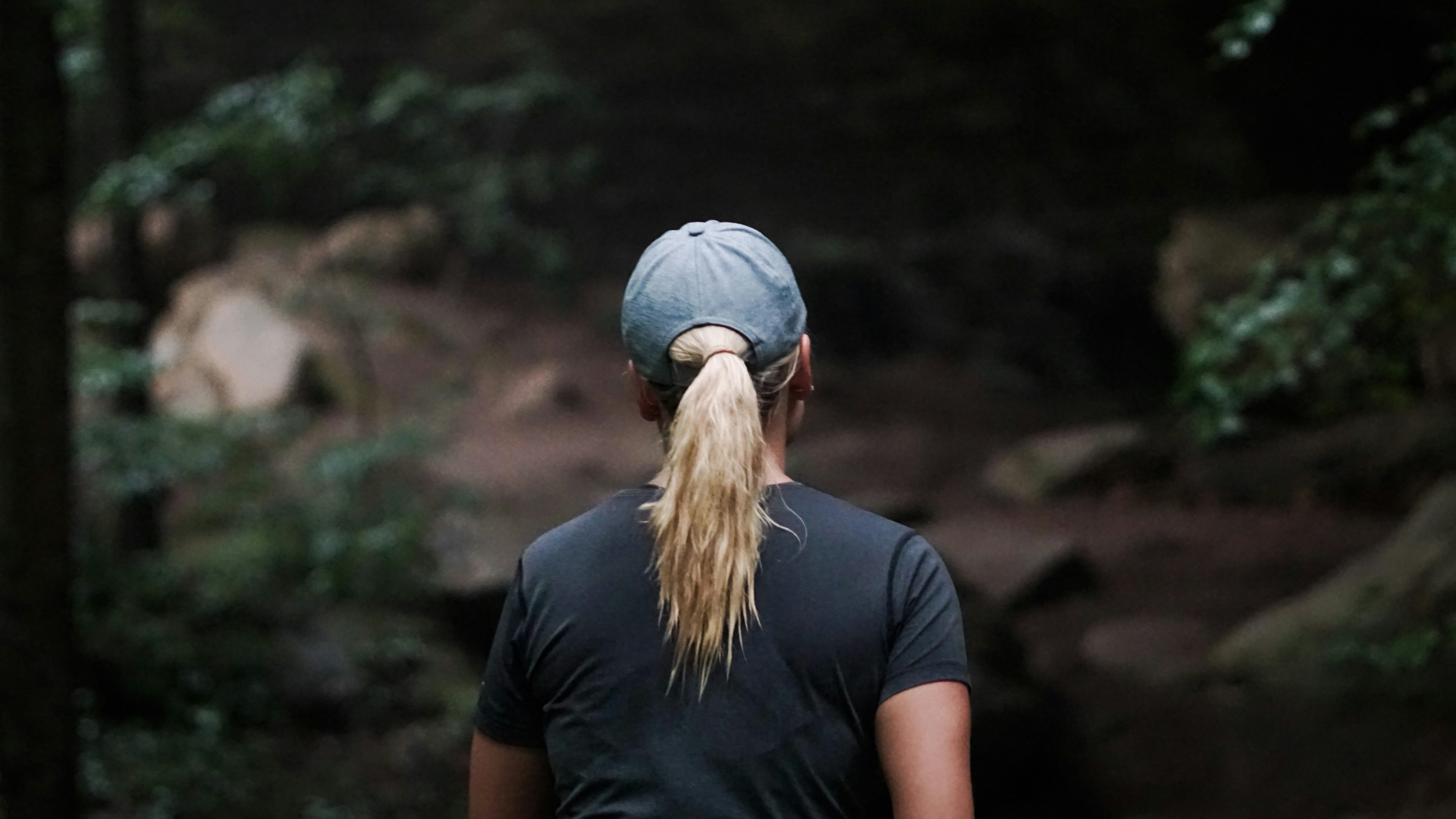 Ponytail in the Pines: A Quiet Forest Portrait from Behind