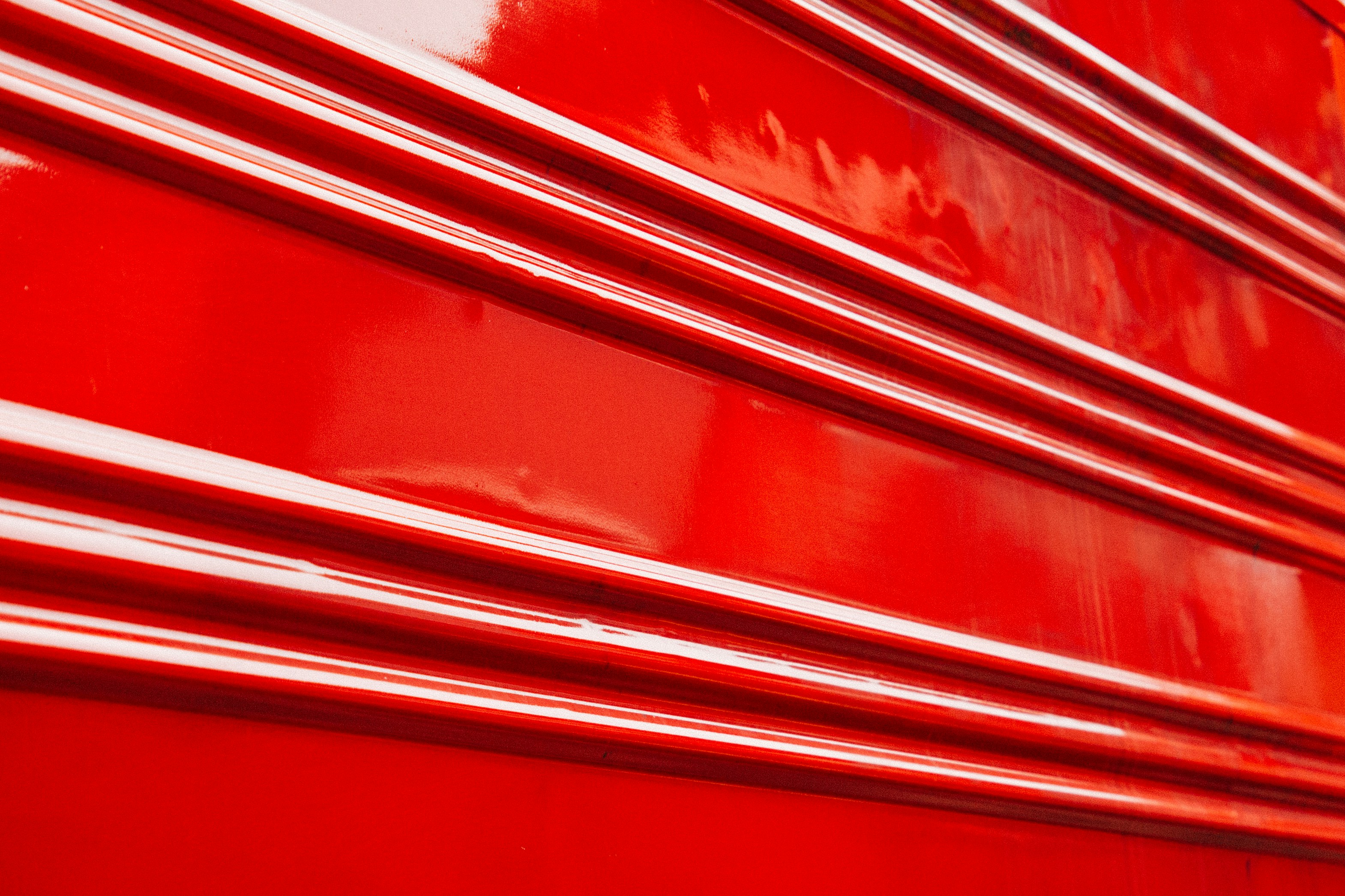 Crimson Ridges on Gleaming Red Metal