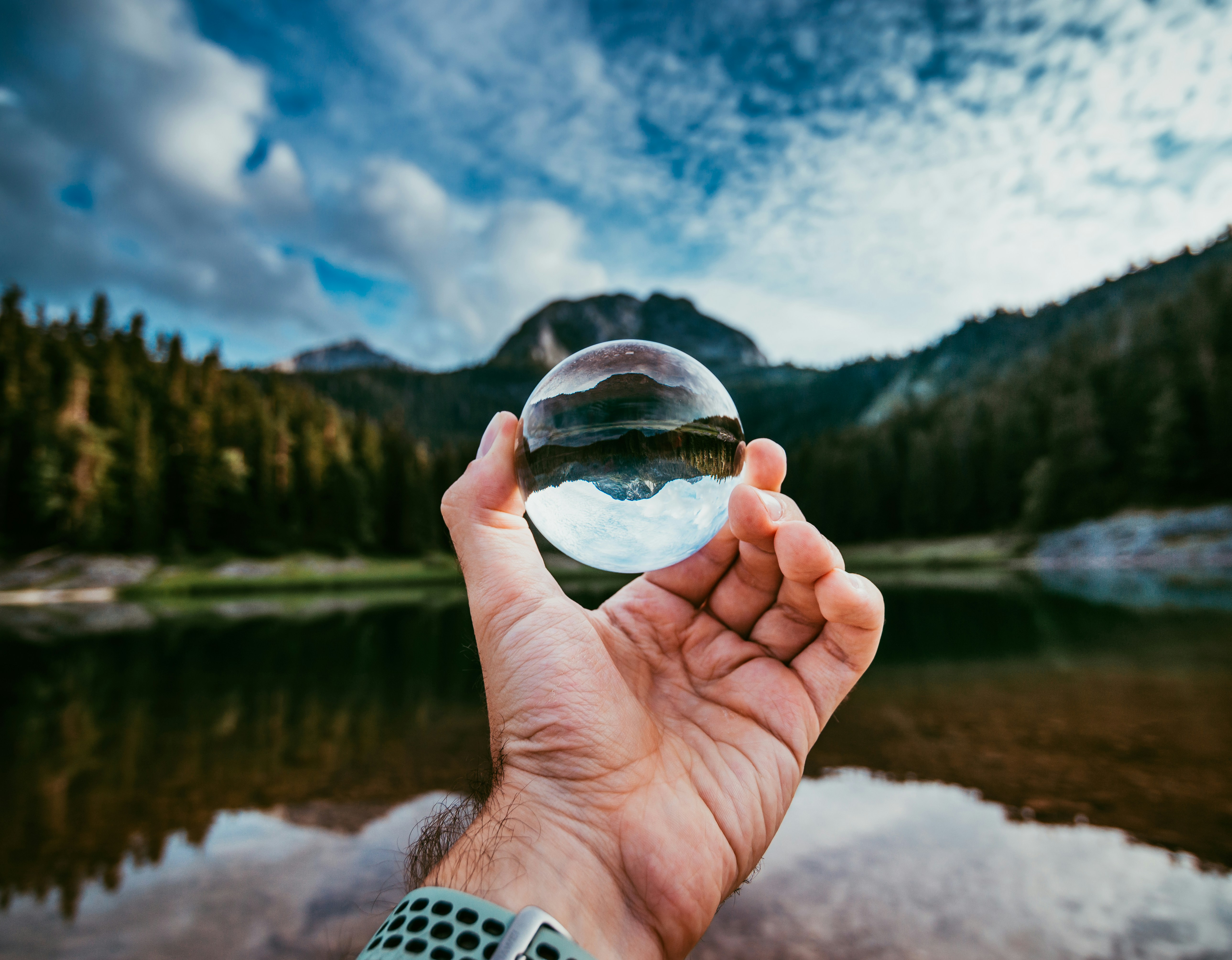 Person holding clear glass ball photo – Free Crno jezero Image on Unsplash