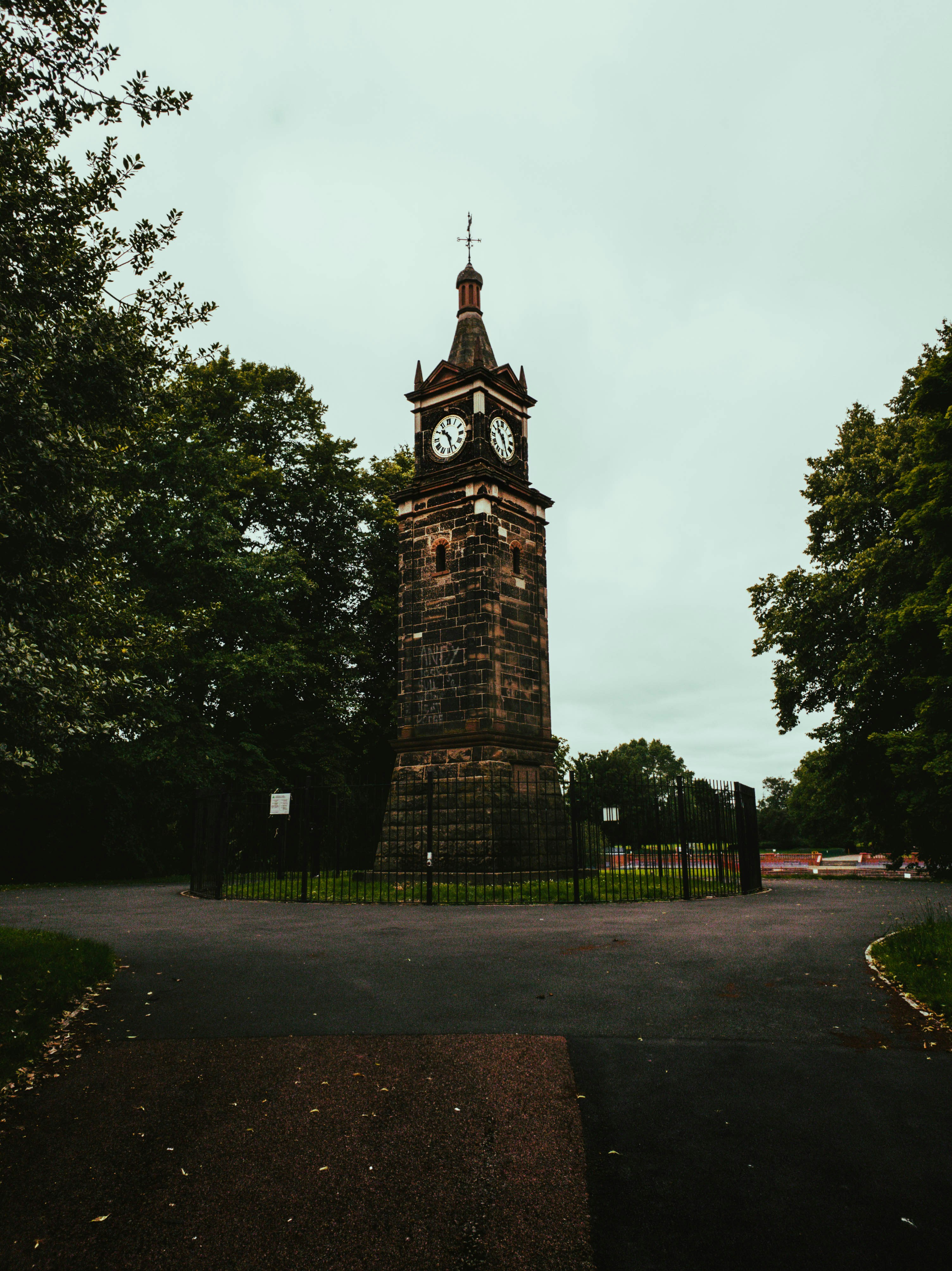 Clocktower in the Park: A Quiet Monument Rising Over the Path