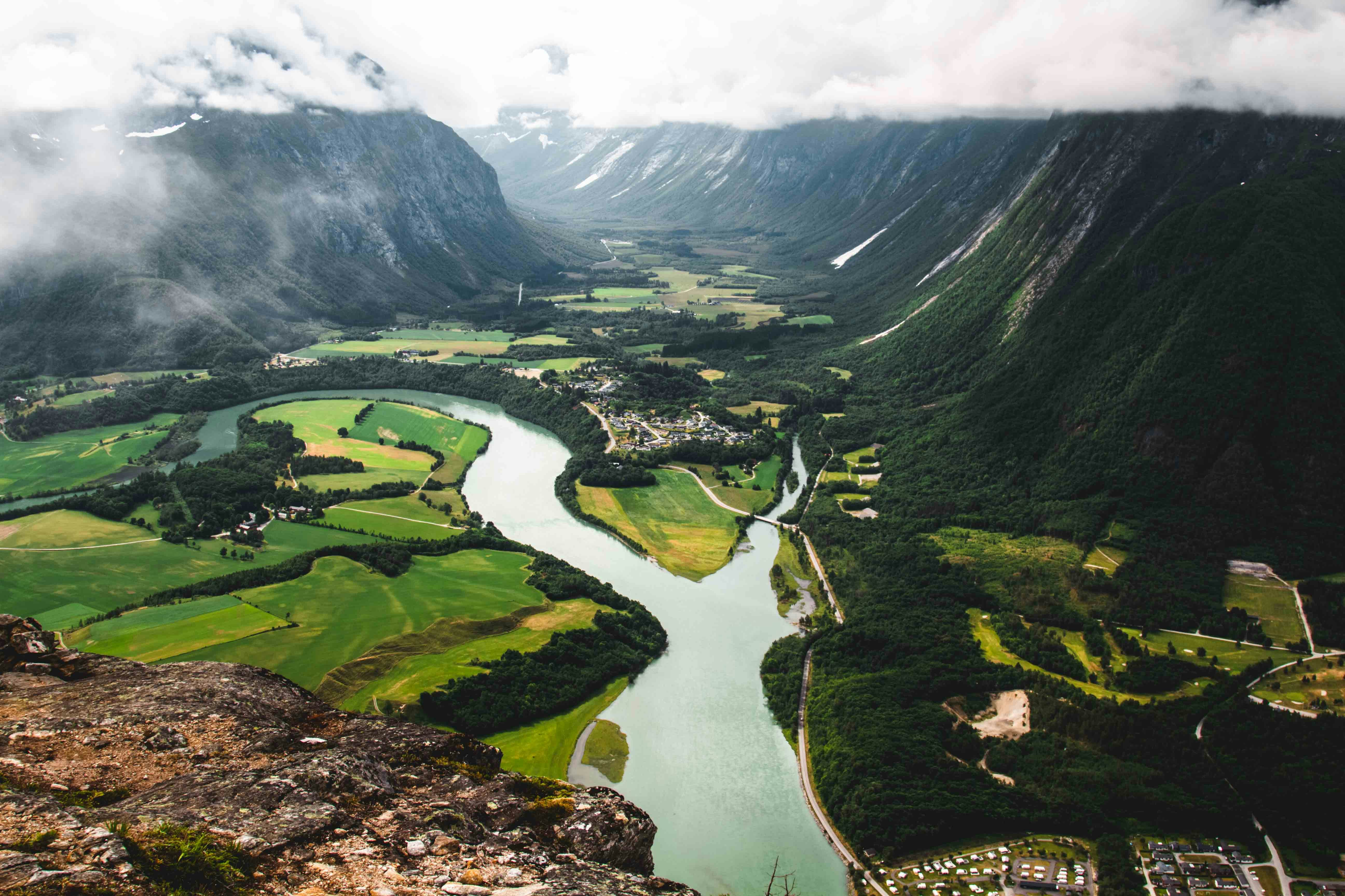 Verdant S-Curve: Cliff-Edge View of a Winding Valley