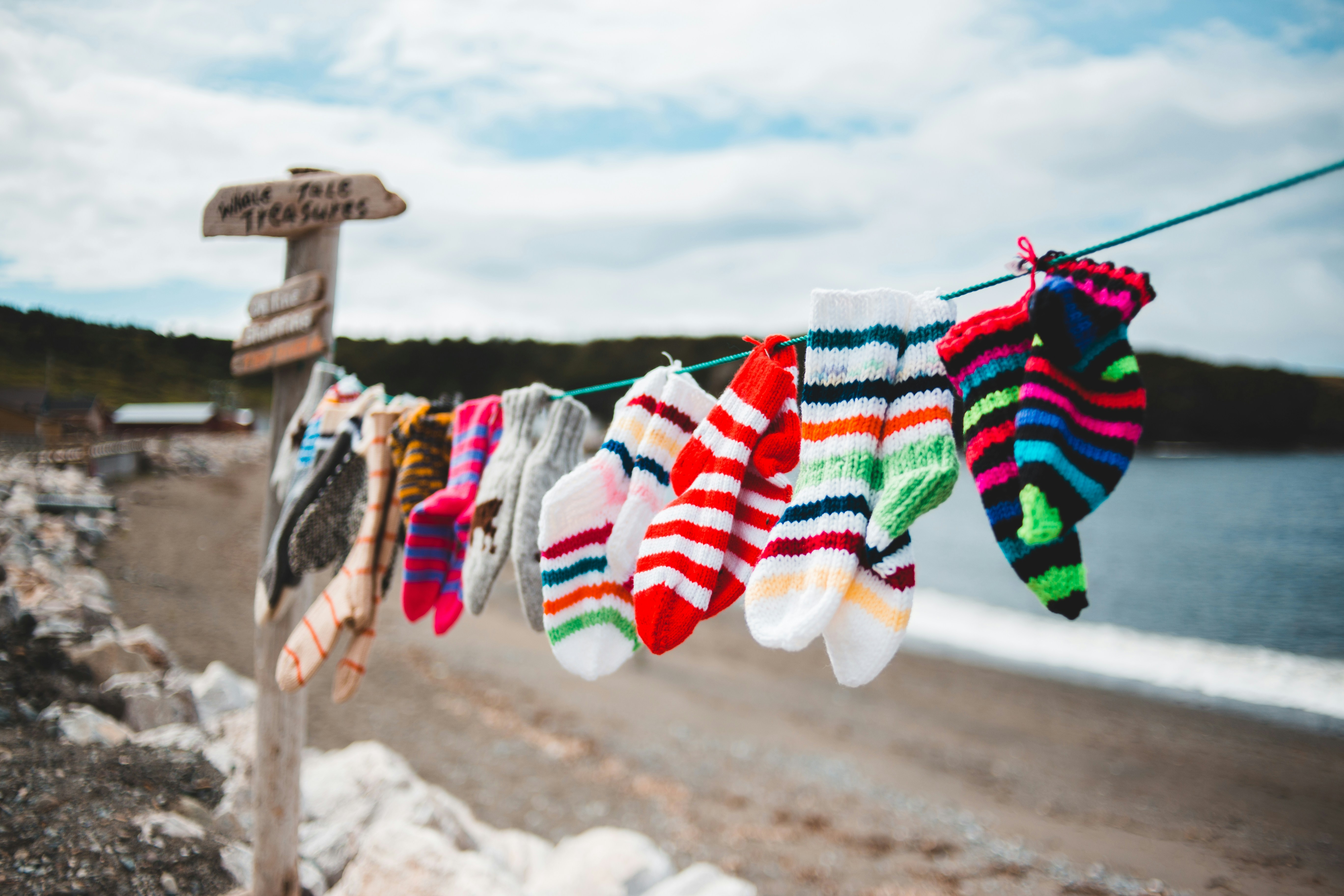 Colorful Sock Garland Along a Windswept Beach