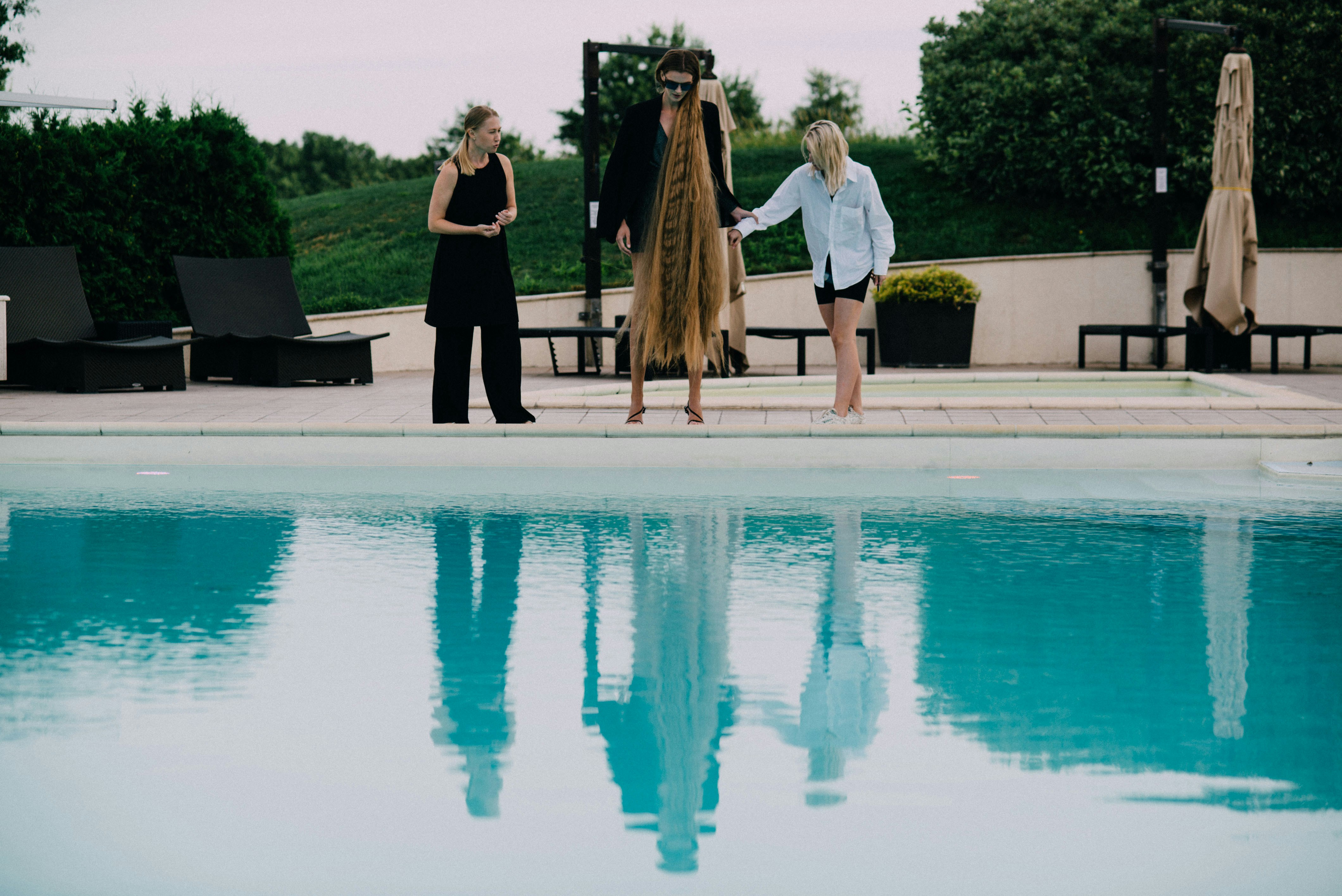 Man and woman standing beside swimming pool during daytime photo – Free ...
