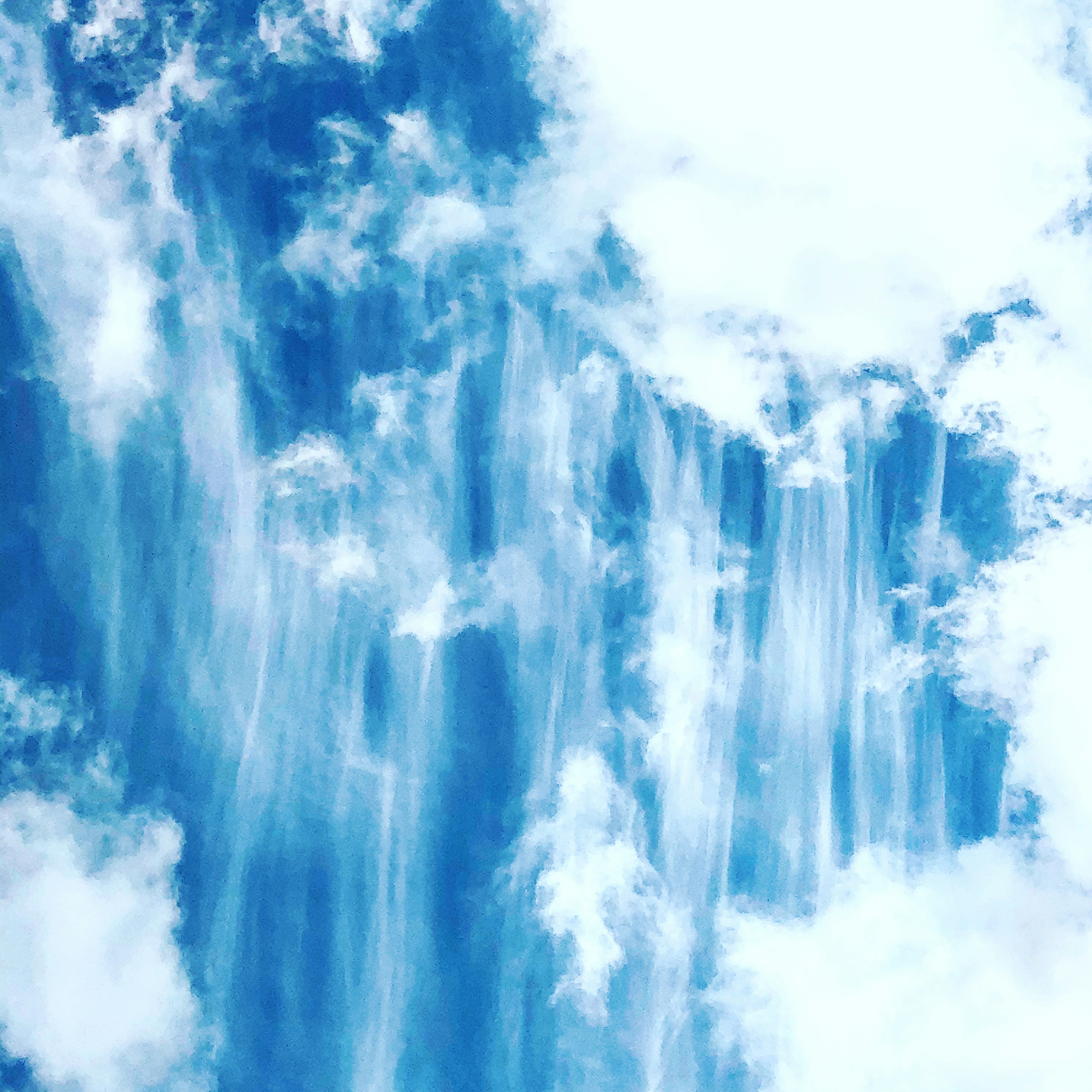 Azure Curtain of Falls: A Skyward Veil of Blue