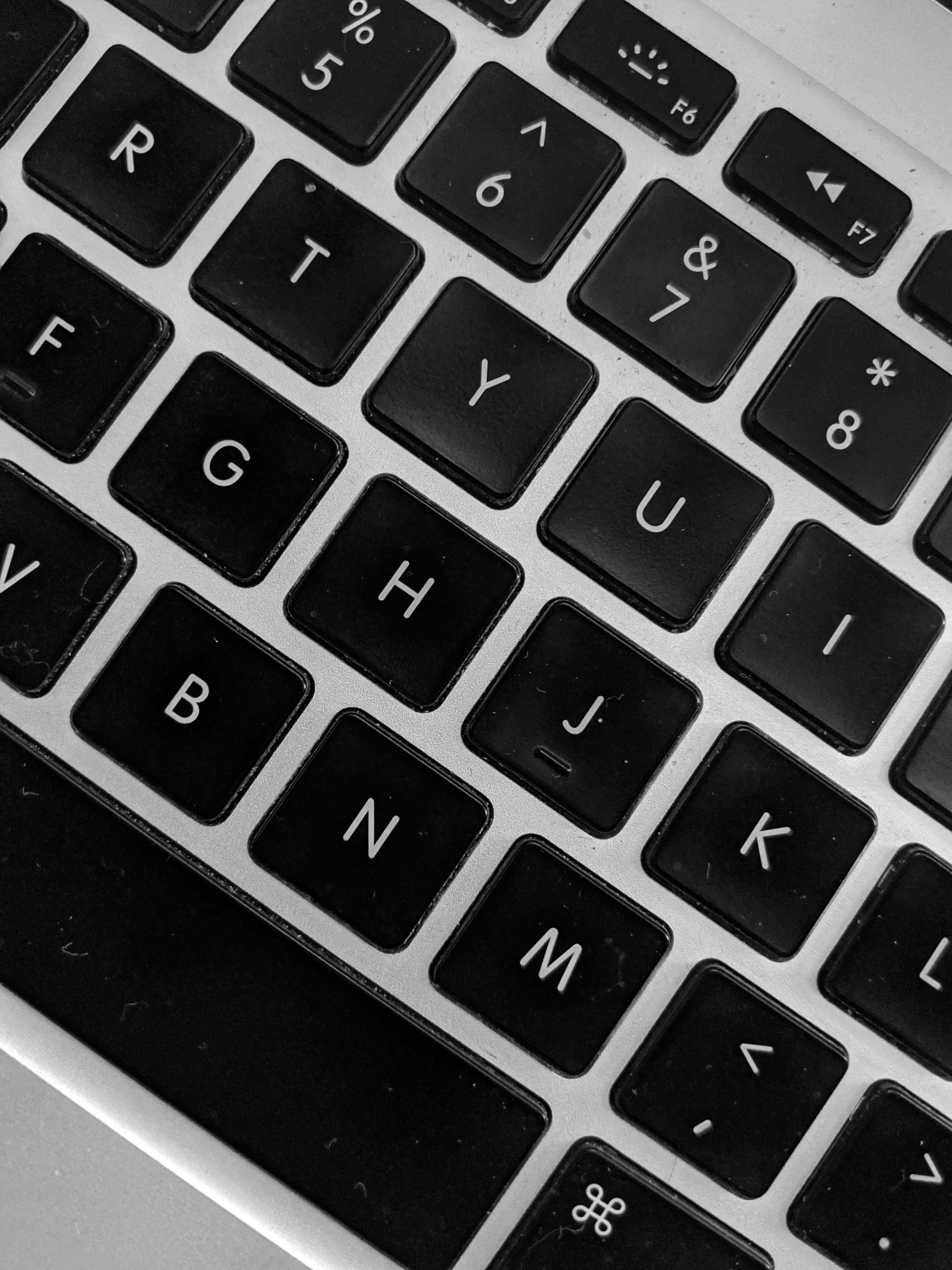 Monochrome Diagonal: Close-Up of Keyboard Keys Revealing Texture and Precision