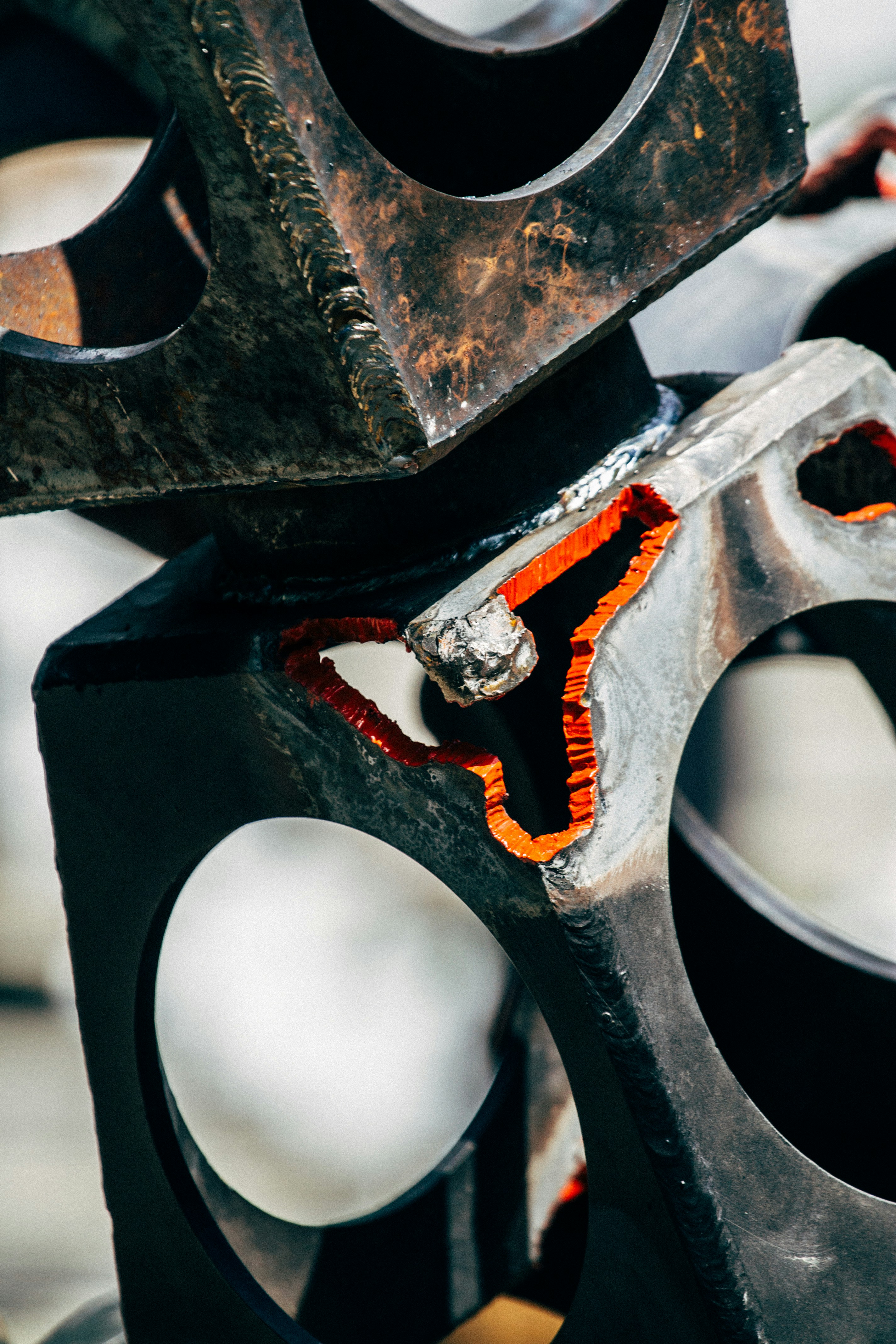 Crimson Cavities: Close-Up of Rusted Geometry with a Molten-Orange Heart