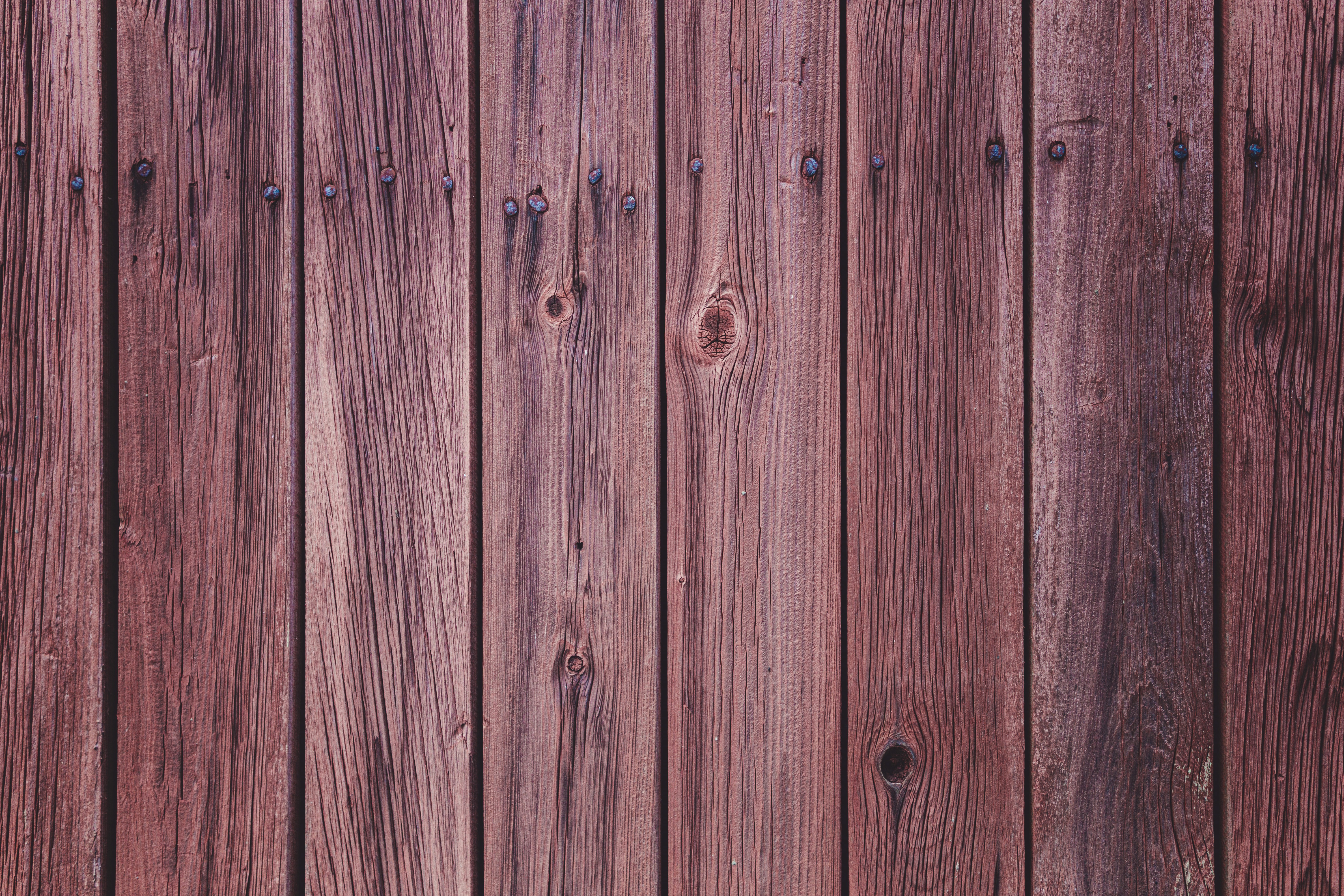 Close-up of weathered wooden planks showcasing rich textures and natural hues.