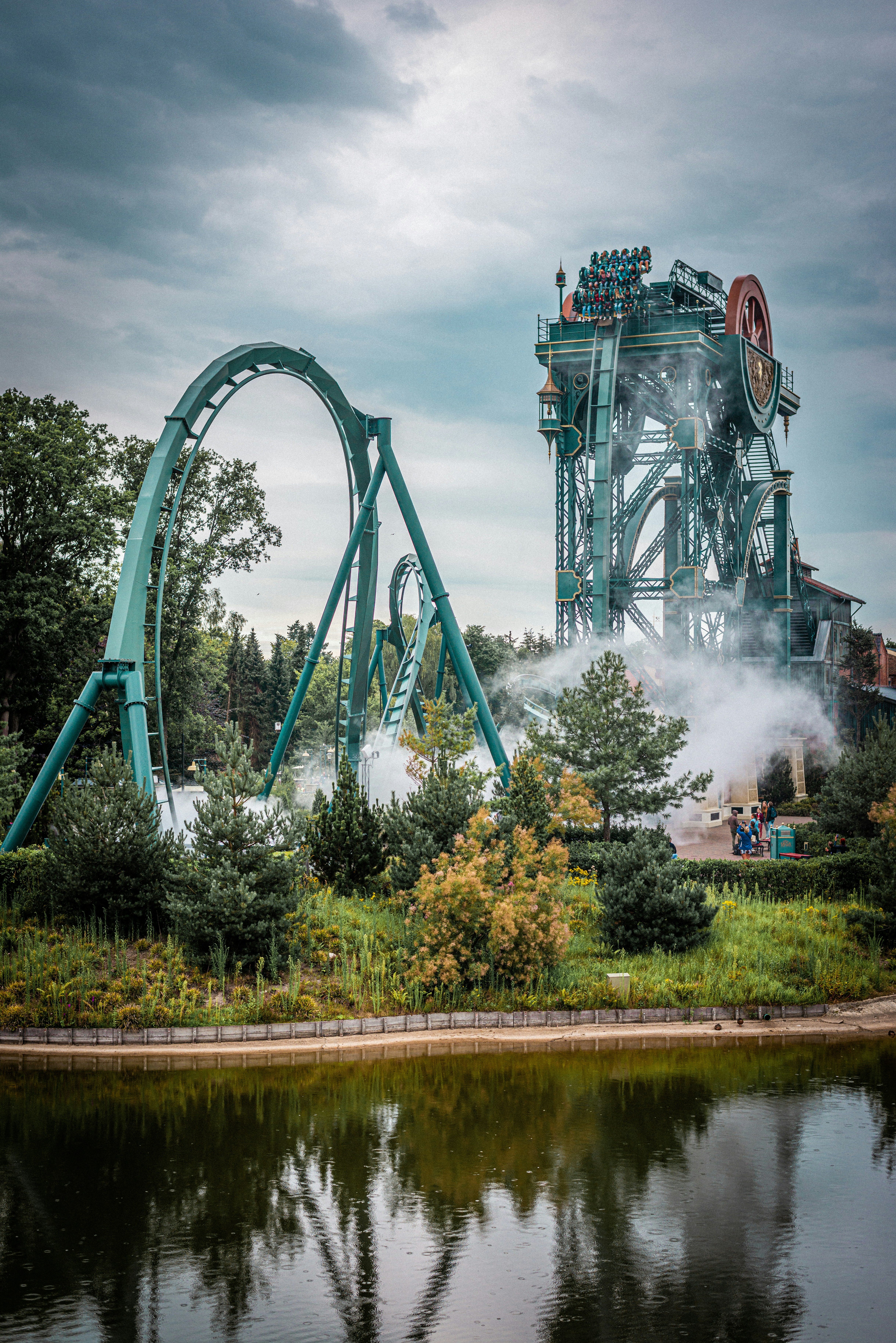 Blue roller coaster on green grass field during daytime photo – Free ...
