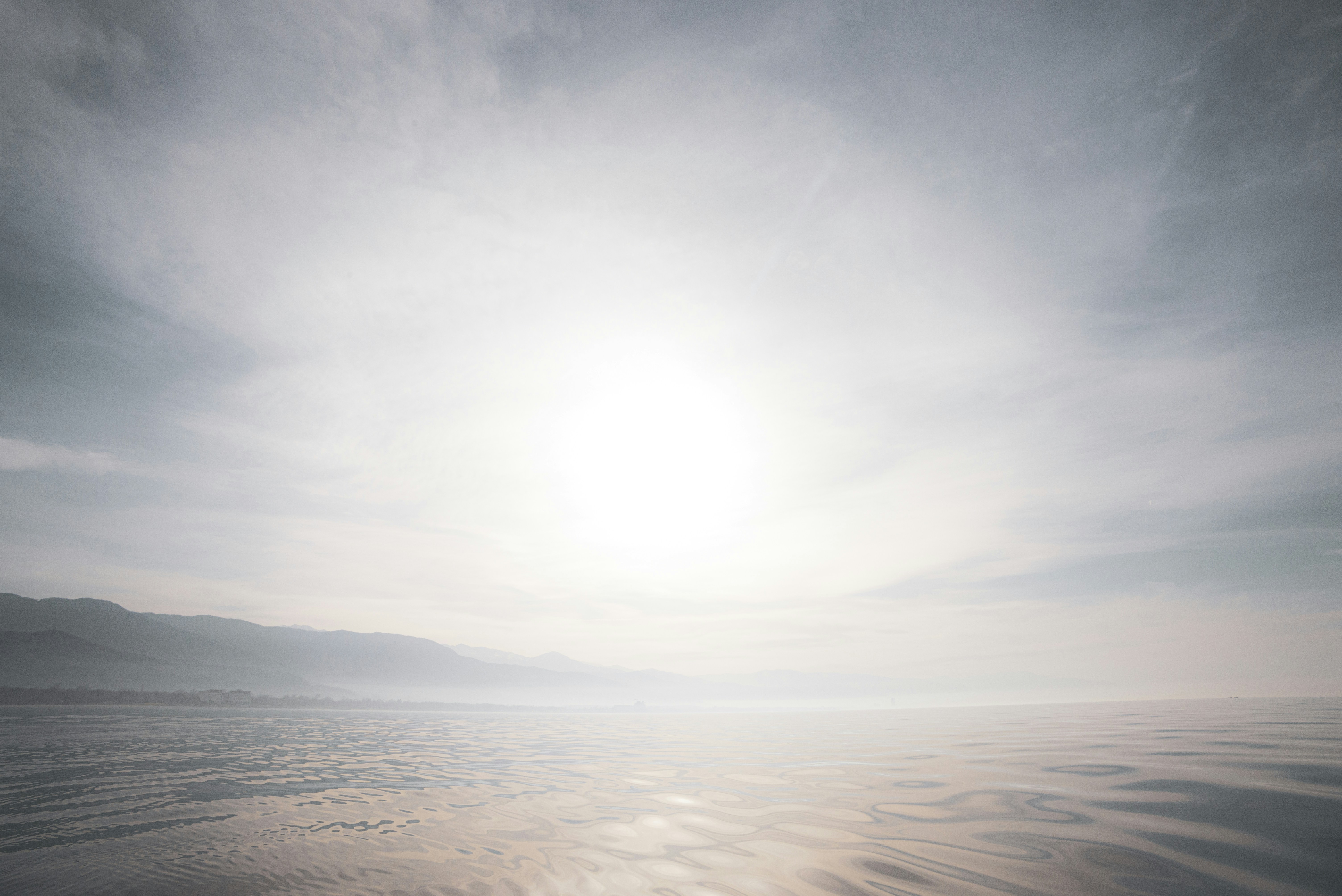 Caspian sea | body of water under white clouds during daytime