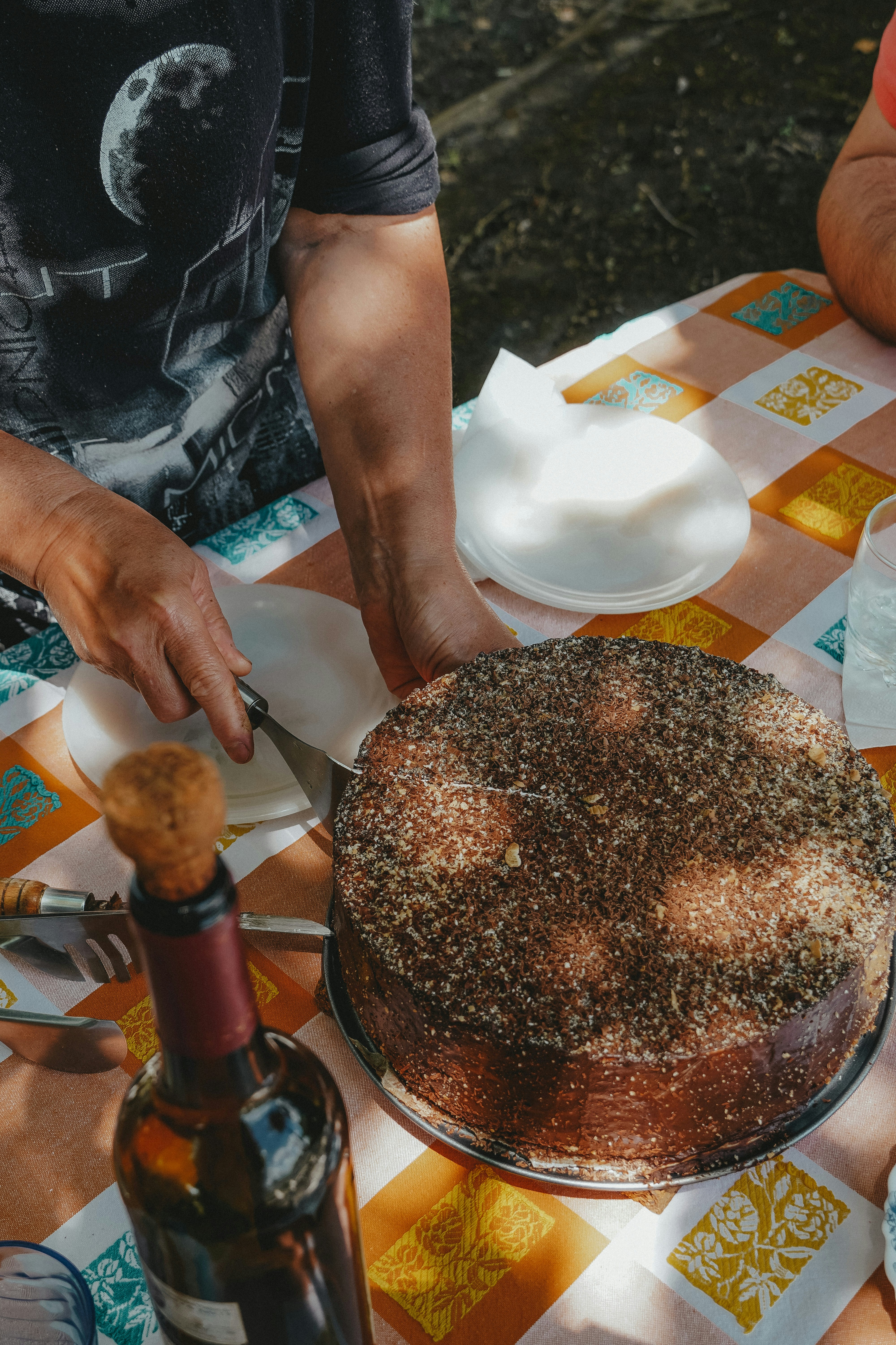 Sugared Summit: A Cocoa-Crystal Cake at a Sunlit Table