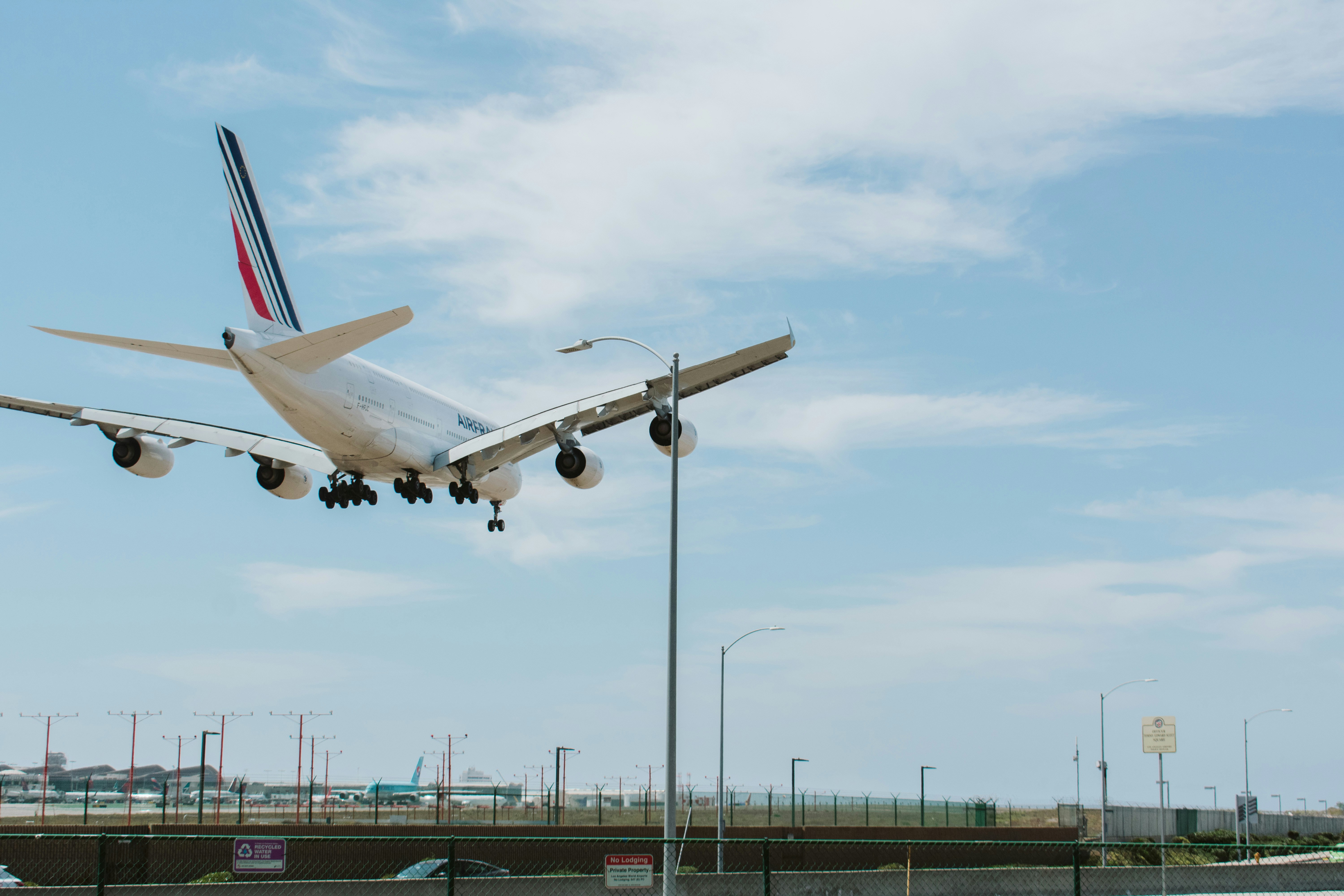 White and blue passenger plane in the airport during daytime photo ...