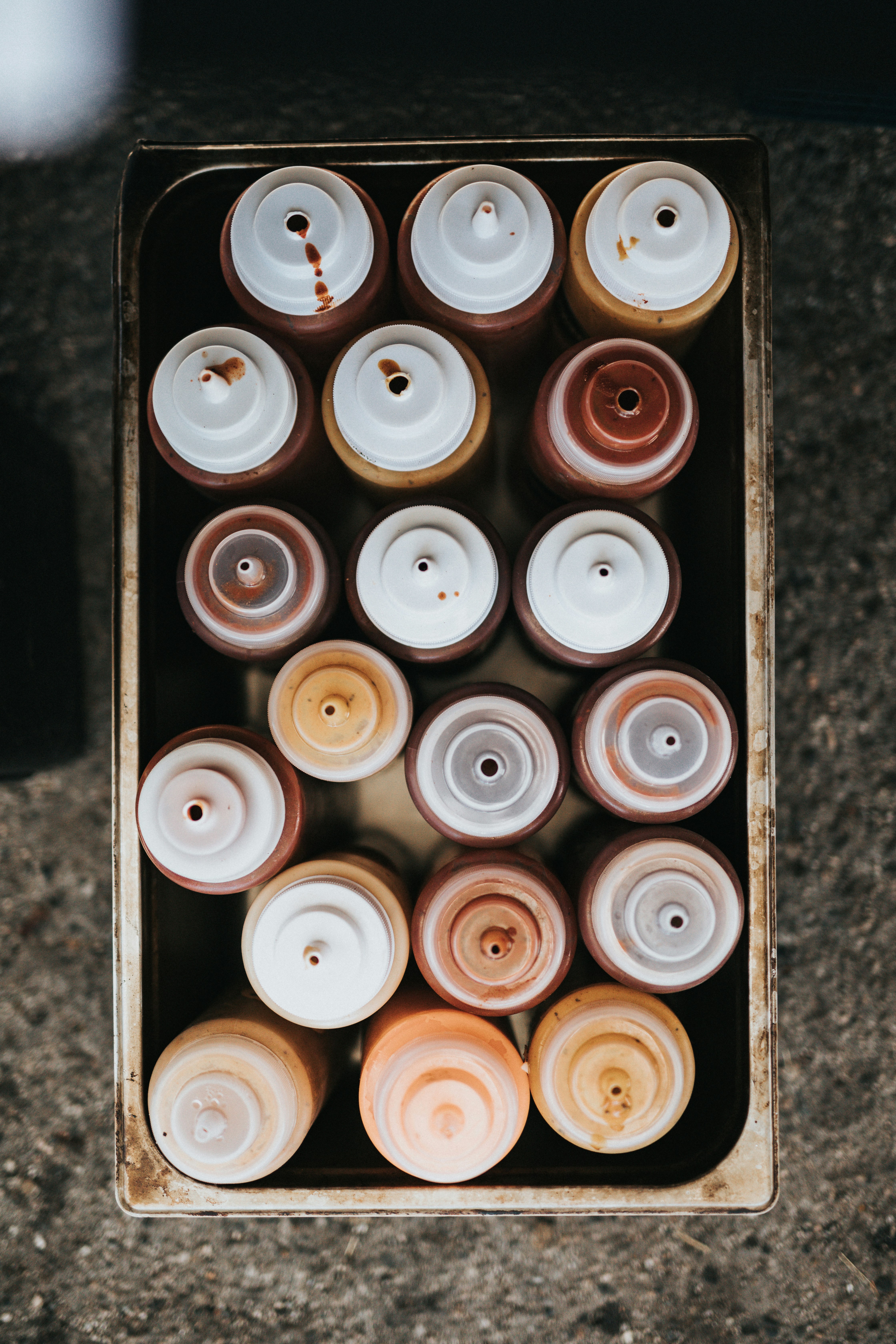 Vertical Tray of Paint Bottles: An Overhead Palette of Pastels