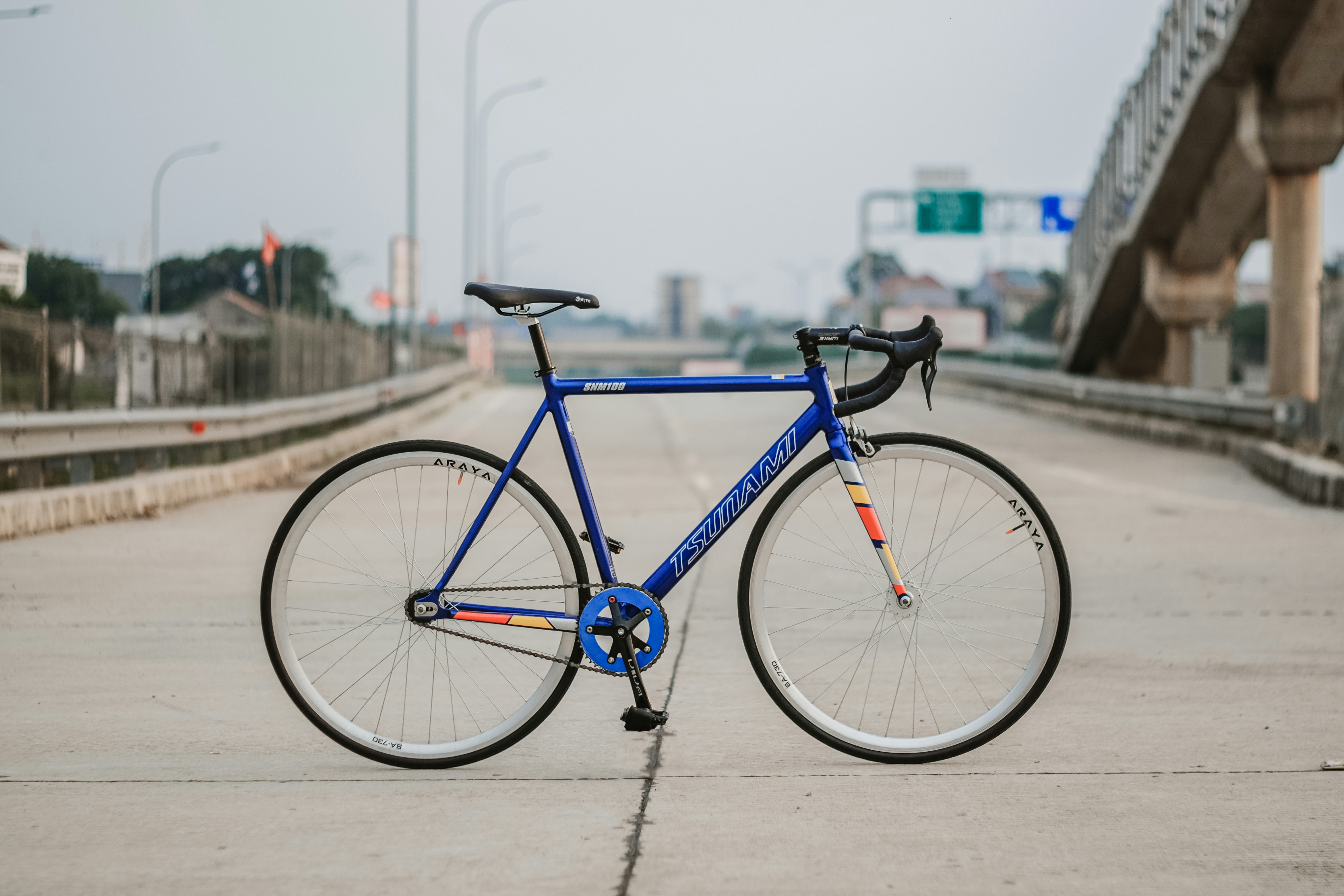 Blue and black road bike on road during daytime photo – Free Bicycle ...