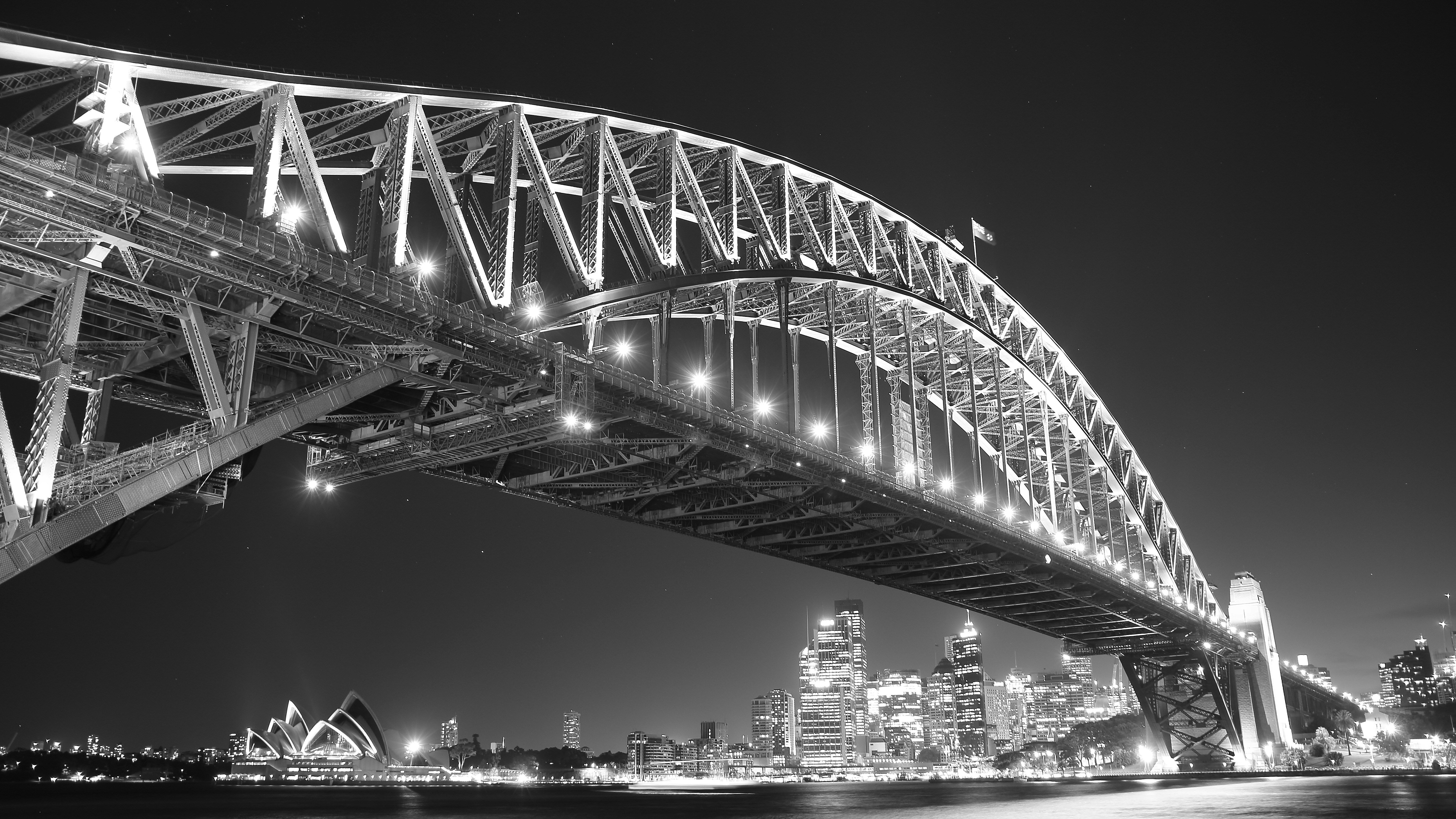 Grayscale photo of bridge over city skyline photo – Free Grey Image on ...