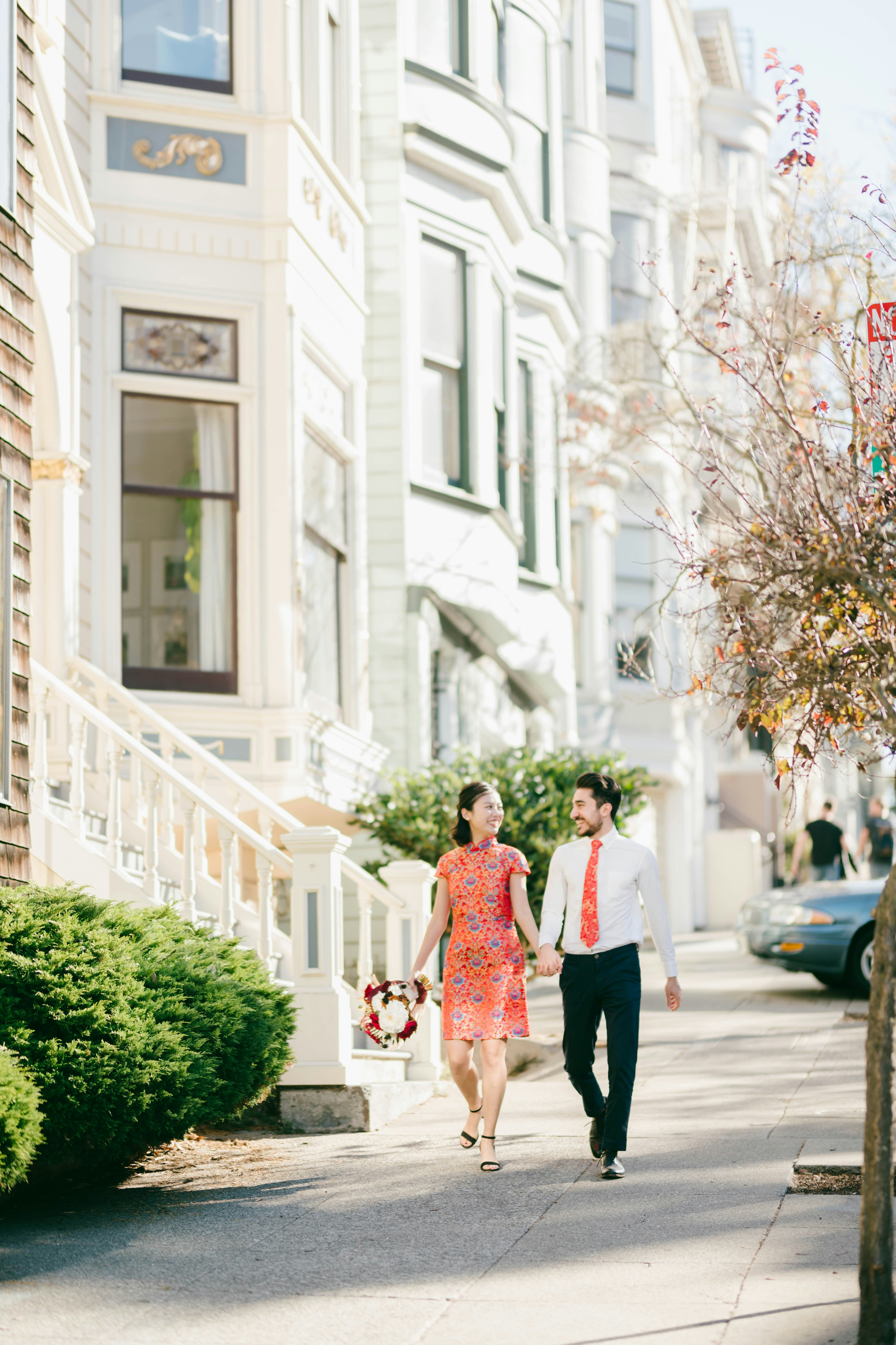 Sunlit stroll on a pastel San Francisco row