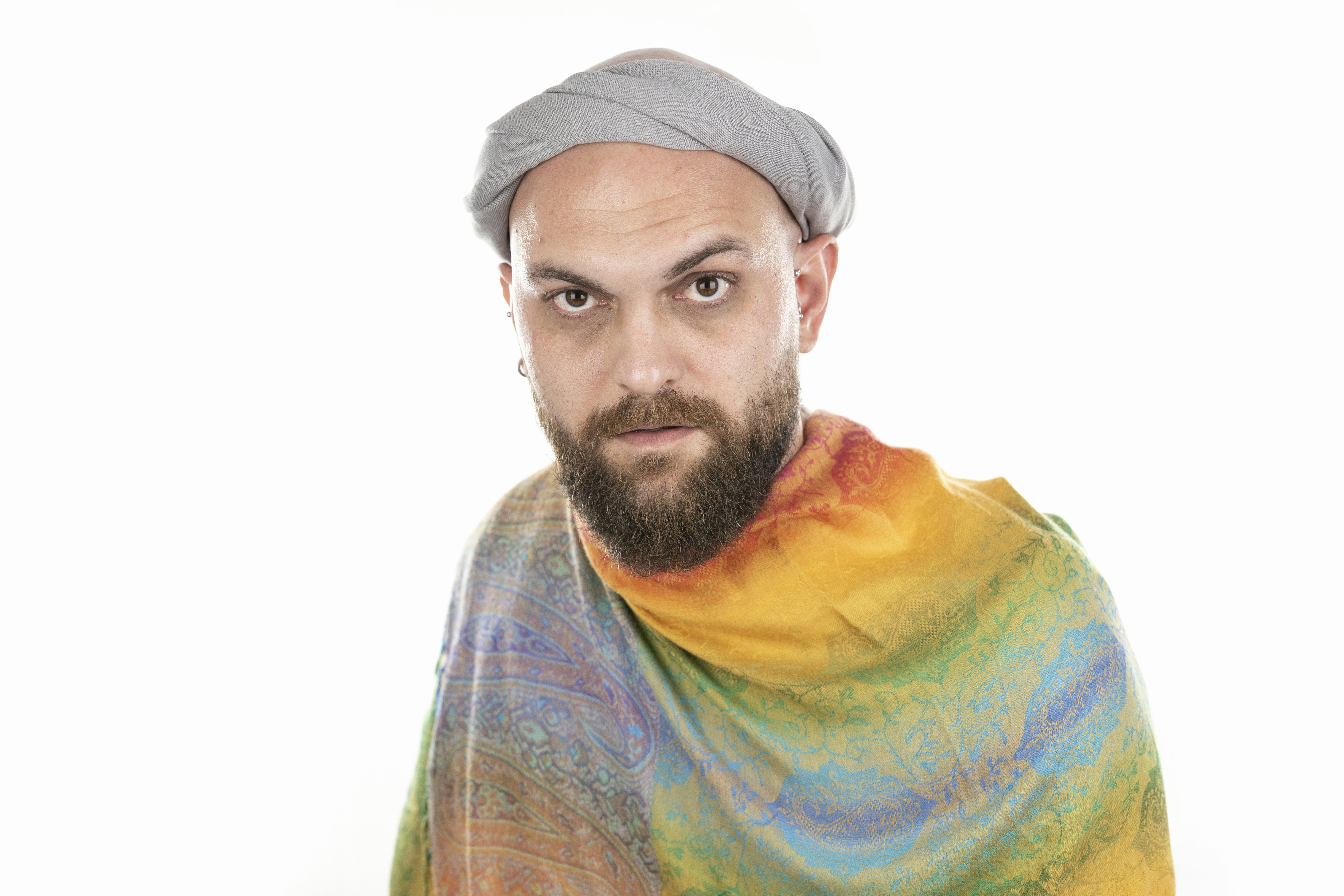 Direct Gaze Through a Prism: Portrait Wrapped in a Rainbow Shawl