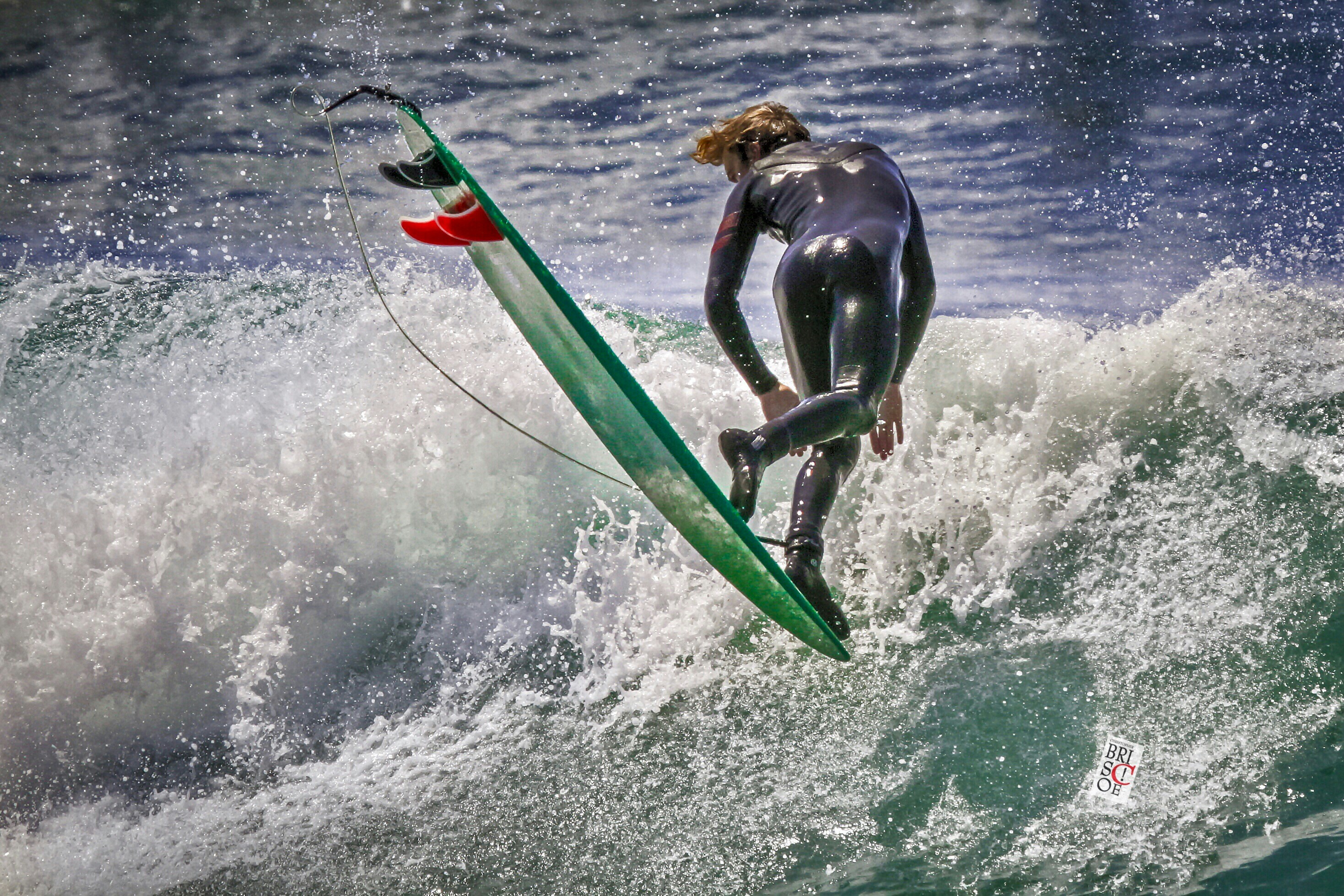 Man in black wet suit riding green surfboard during daytime photo ...