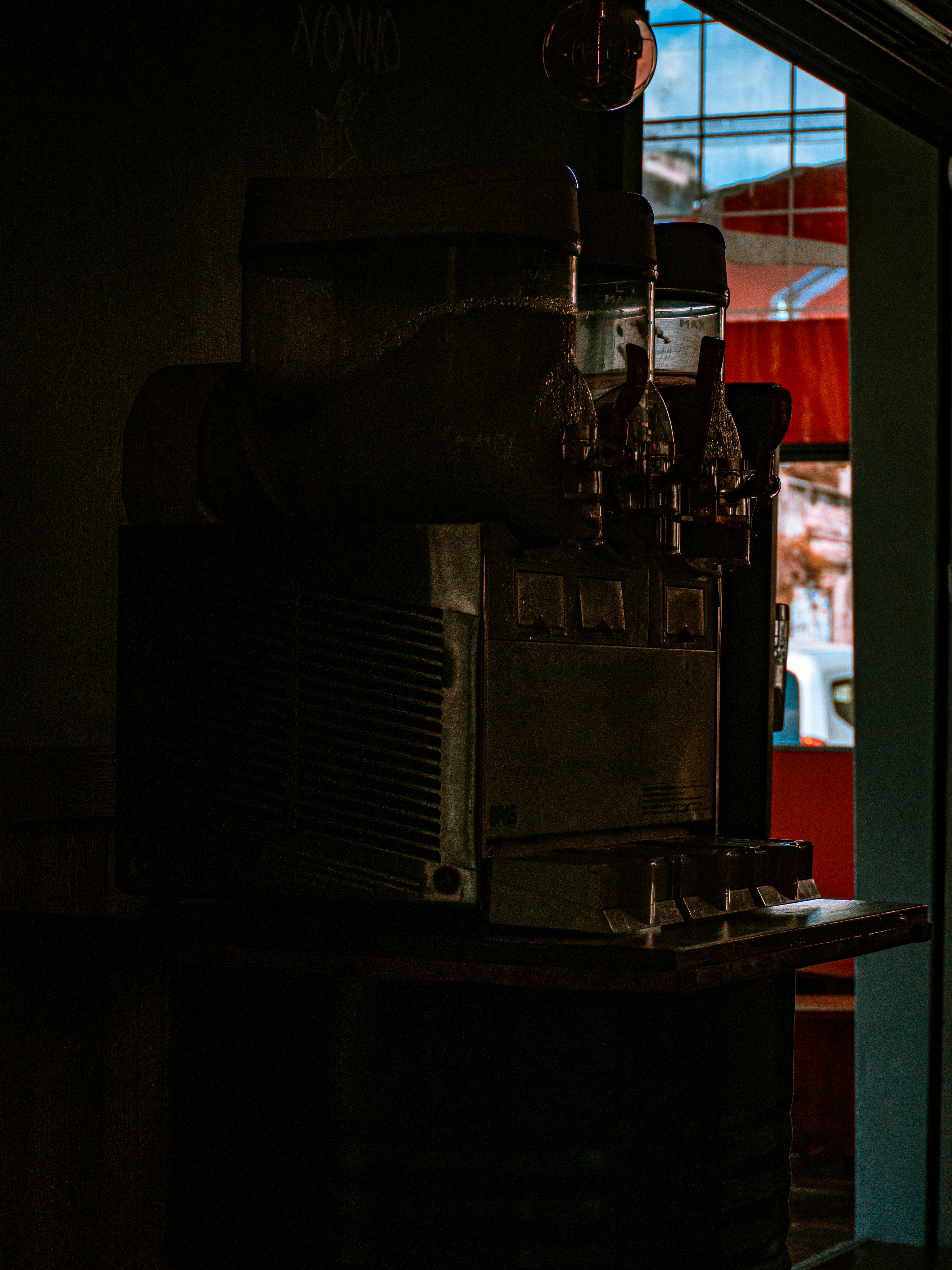 Shadowed Boiler: A Dim Portrait of a Vintage Espresso Machine