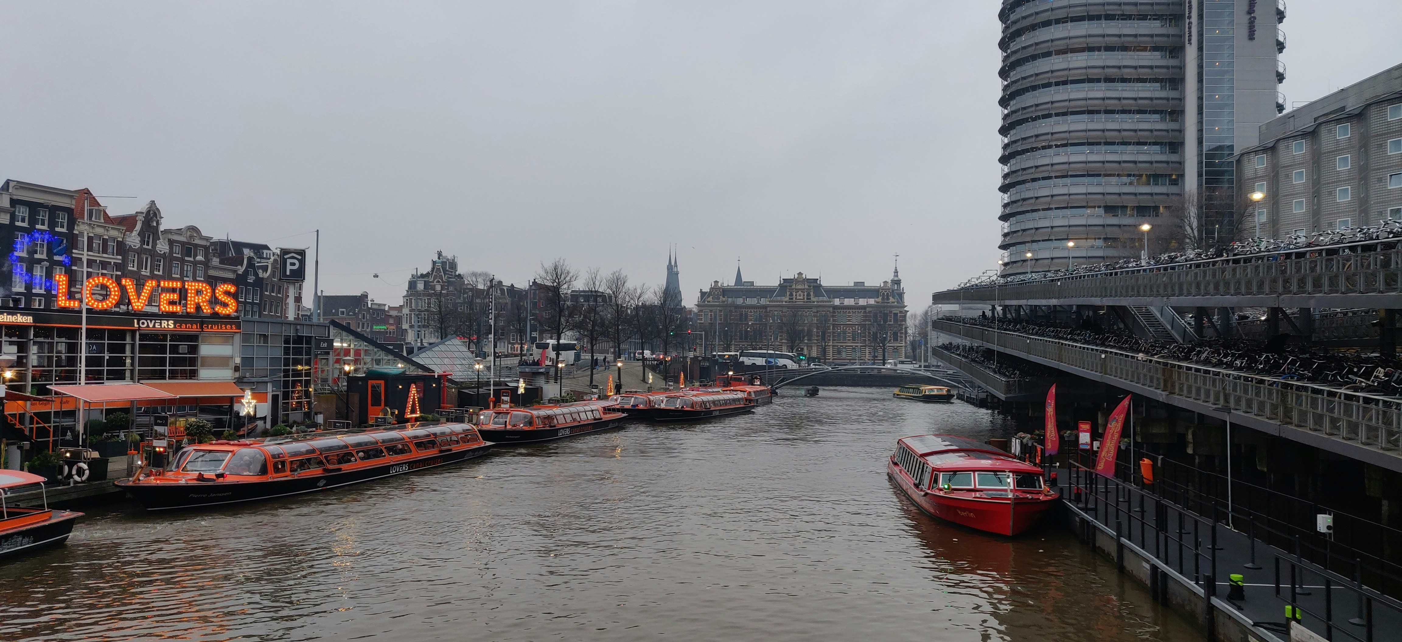 Neon Lovers by the Riverside: Red Boats and Glass Towers