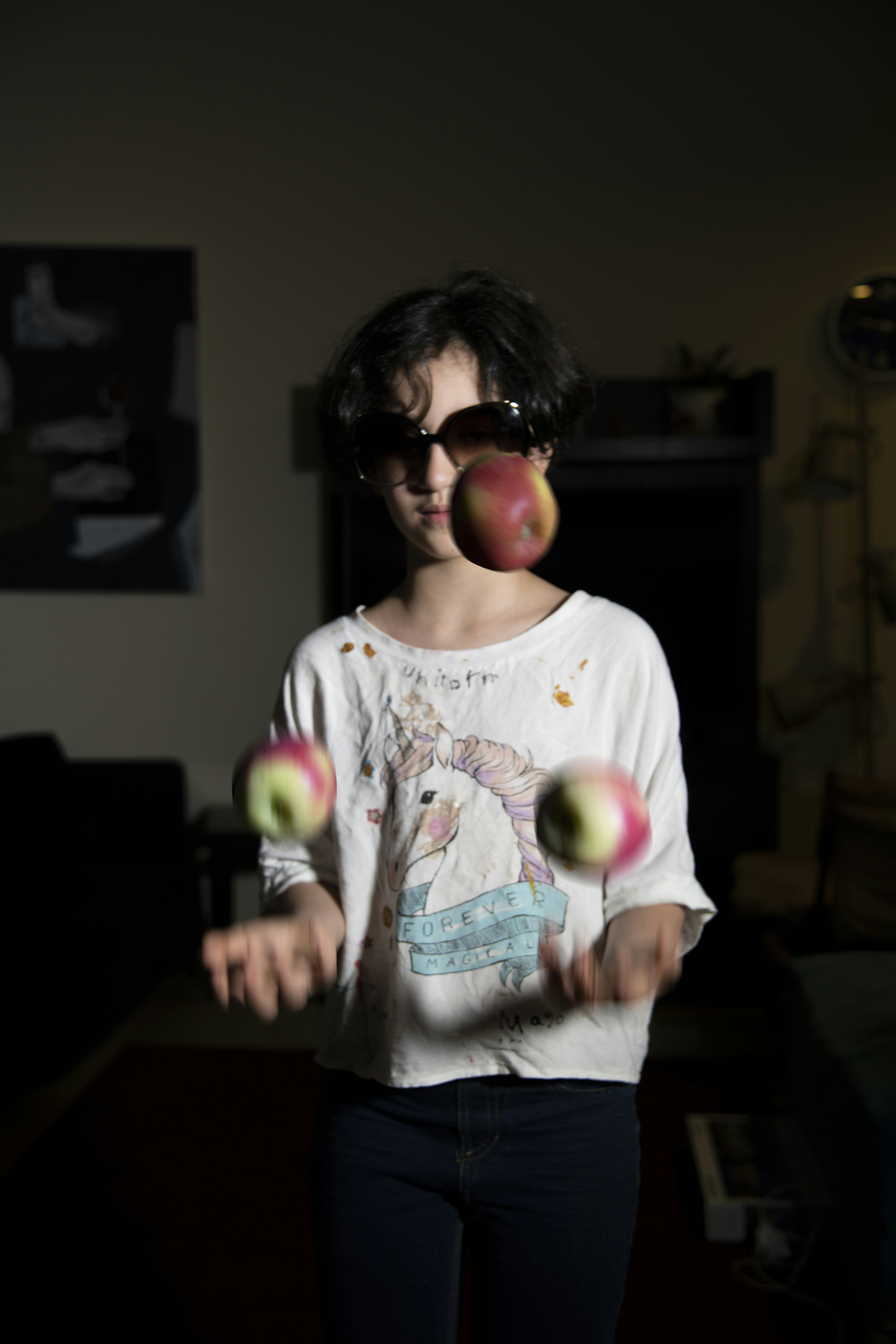Apple Orbs in Motion: A Portrait of Focus and Play