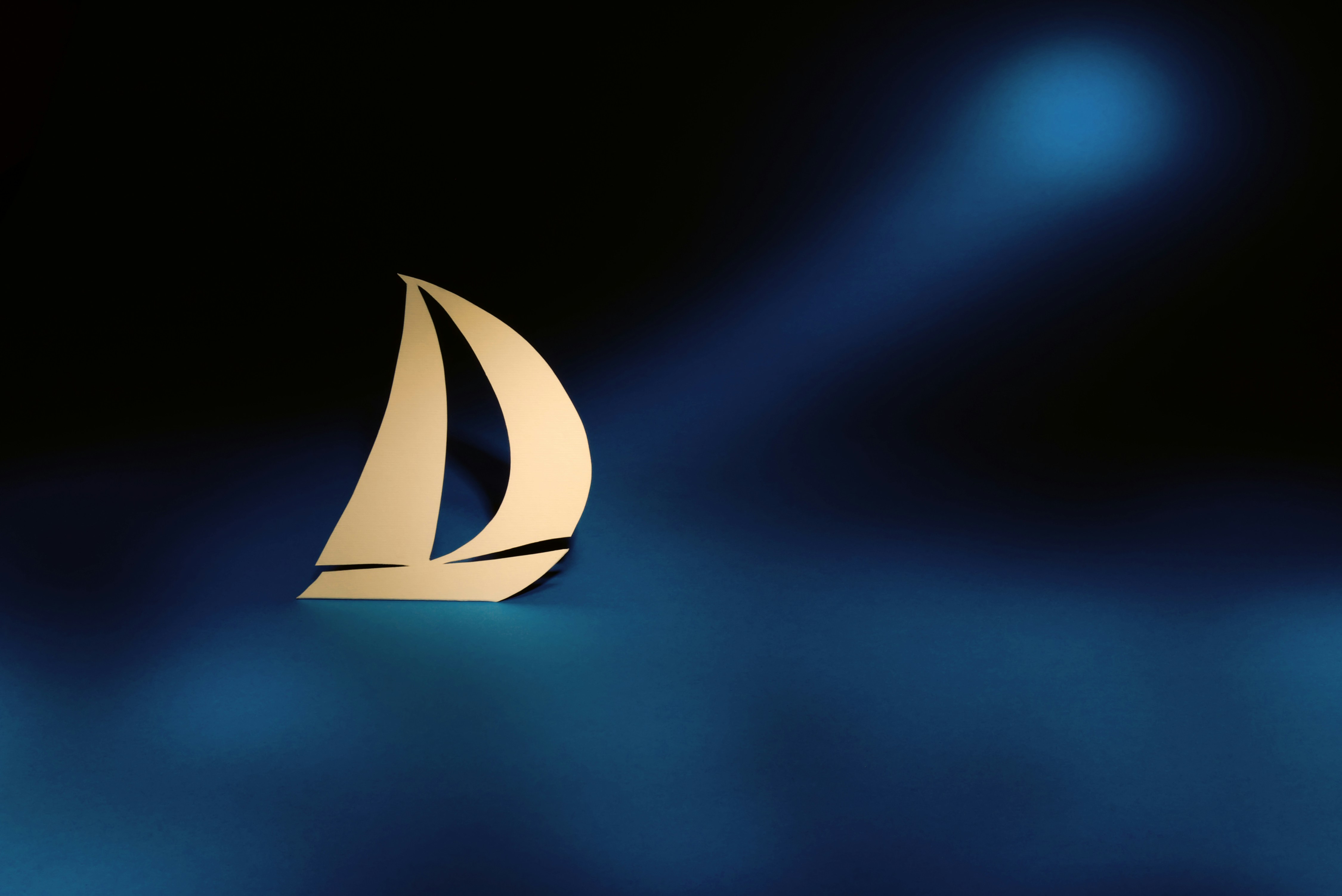 Sailboat Silhouette: Solo Vessel in a Velvet Studio