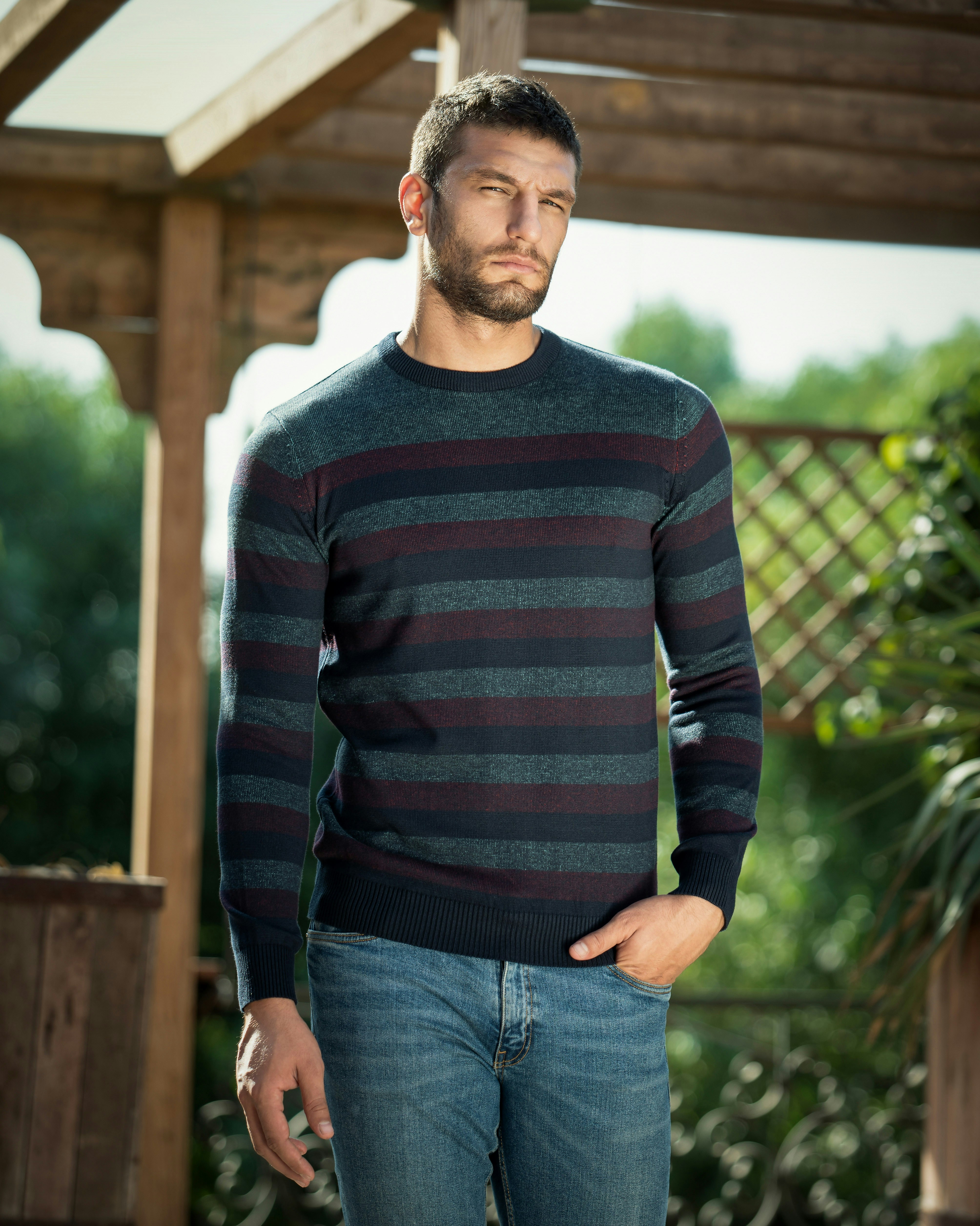 Stripes Under Timber: A Quiet Outdoor Portrait