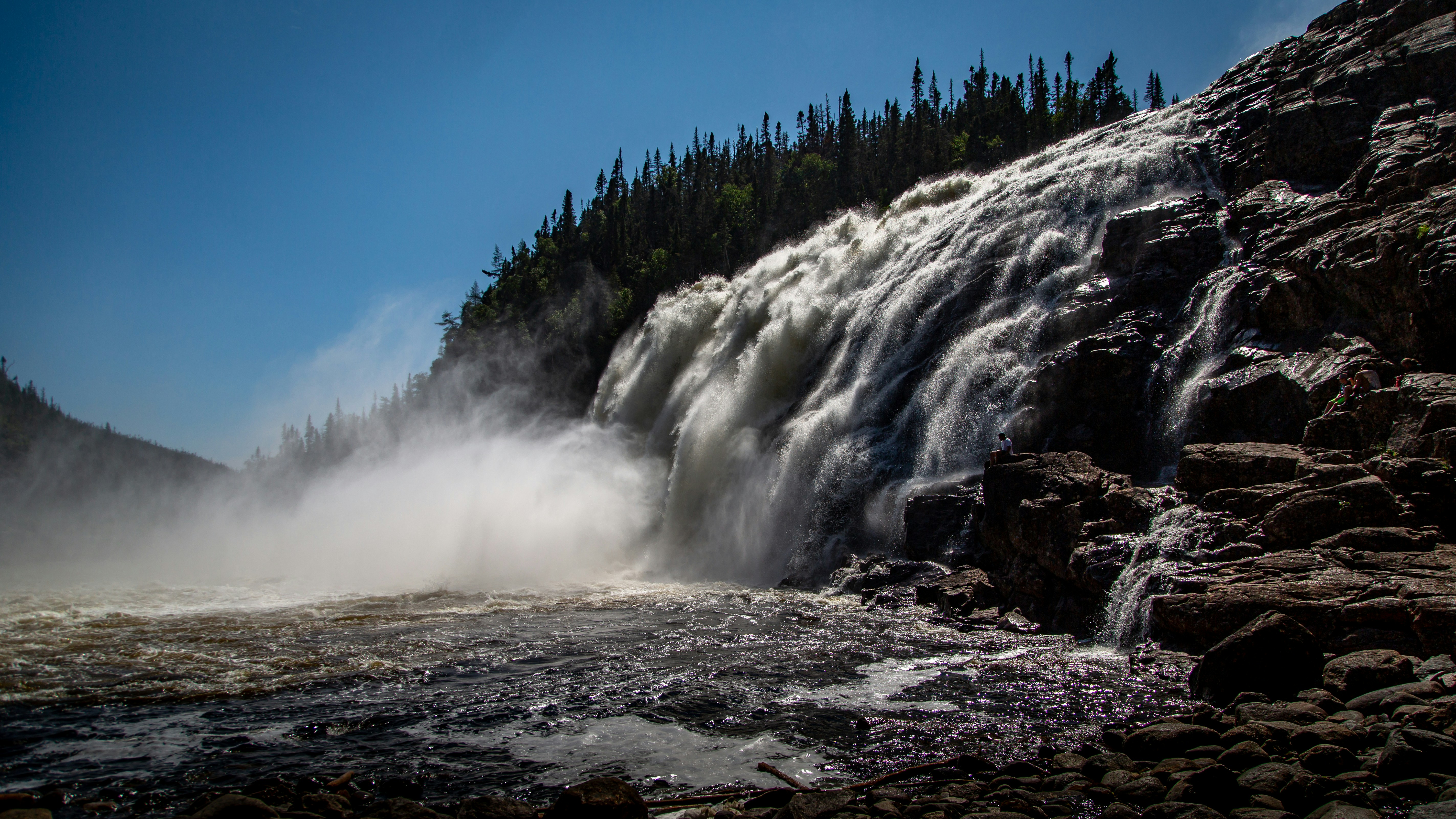 Mistbound Cascade Over Rugged Granite Ridge