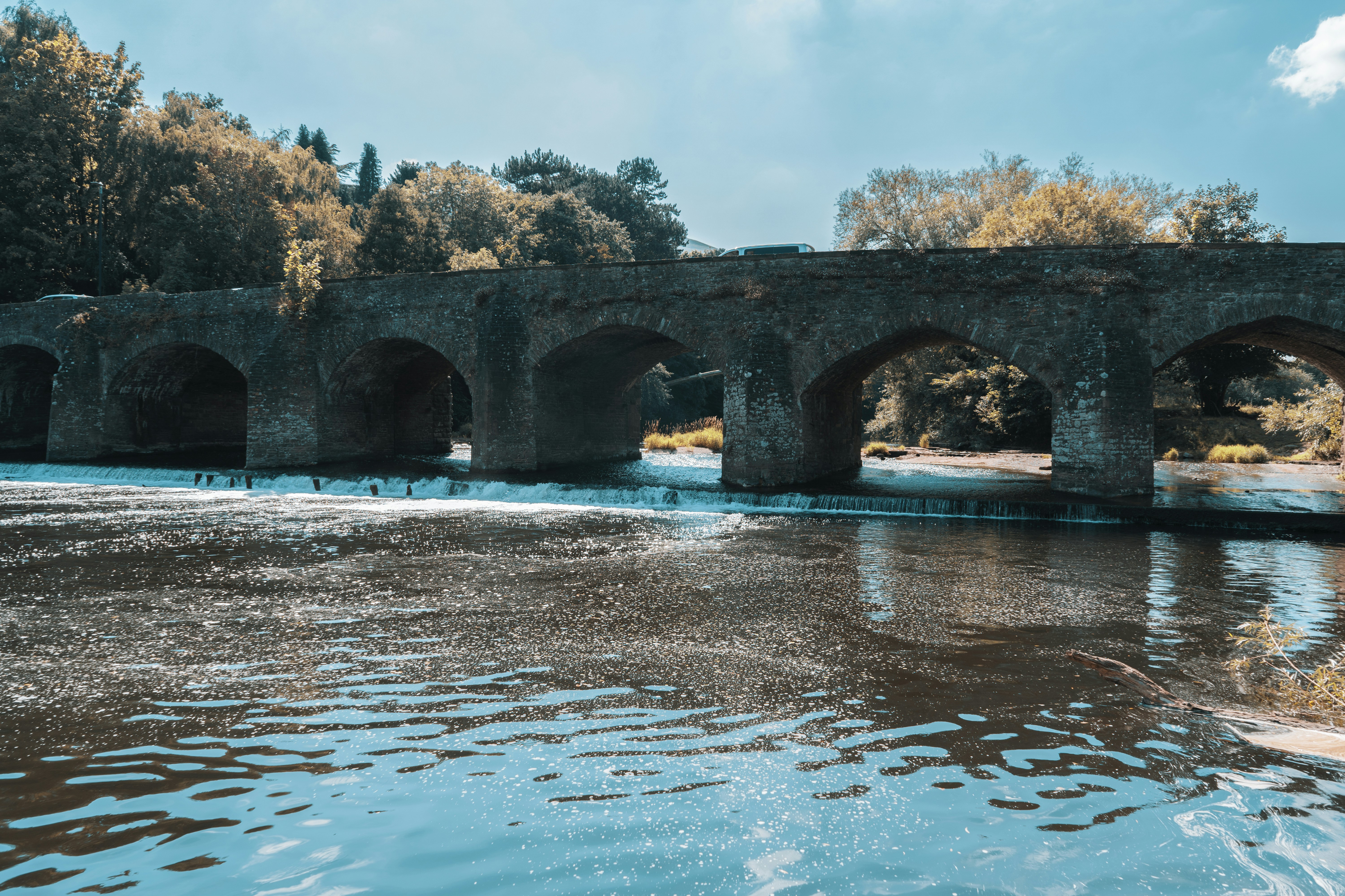 Gray concrete bridge over river during daytime photo – Free Water Image ...