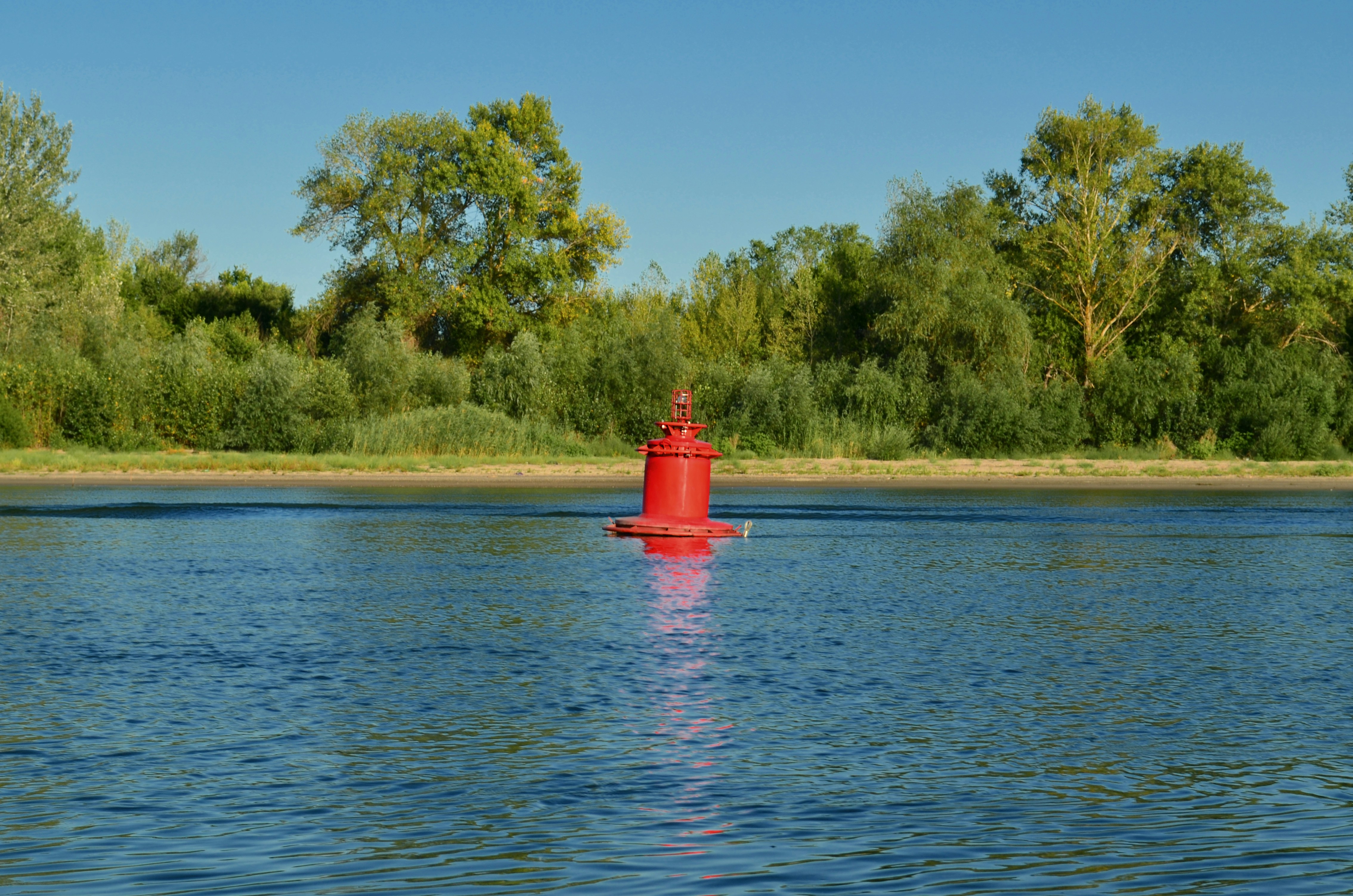 Red Beacon in a Quiet River