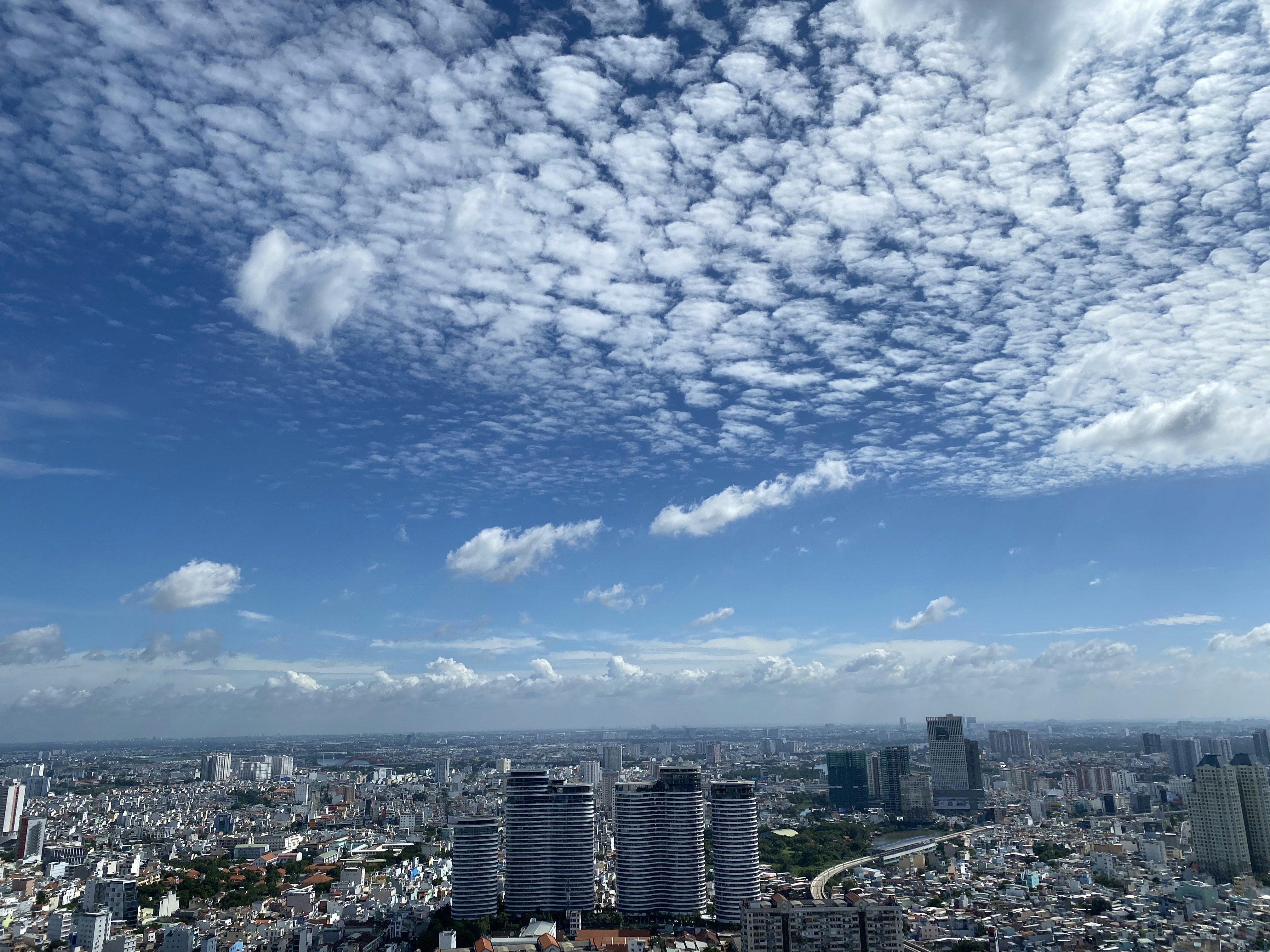 City skyline under blue and white cloudy sky during daytime photo ...