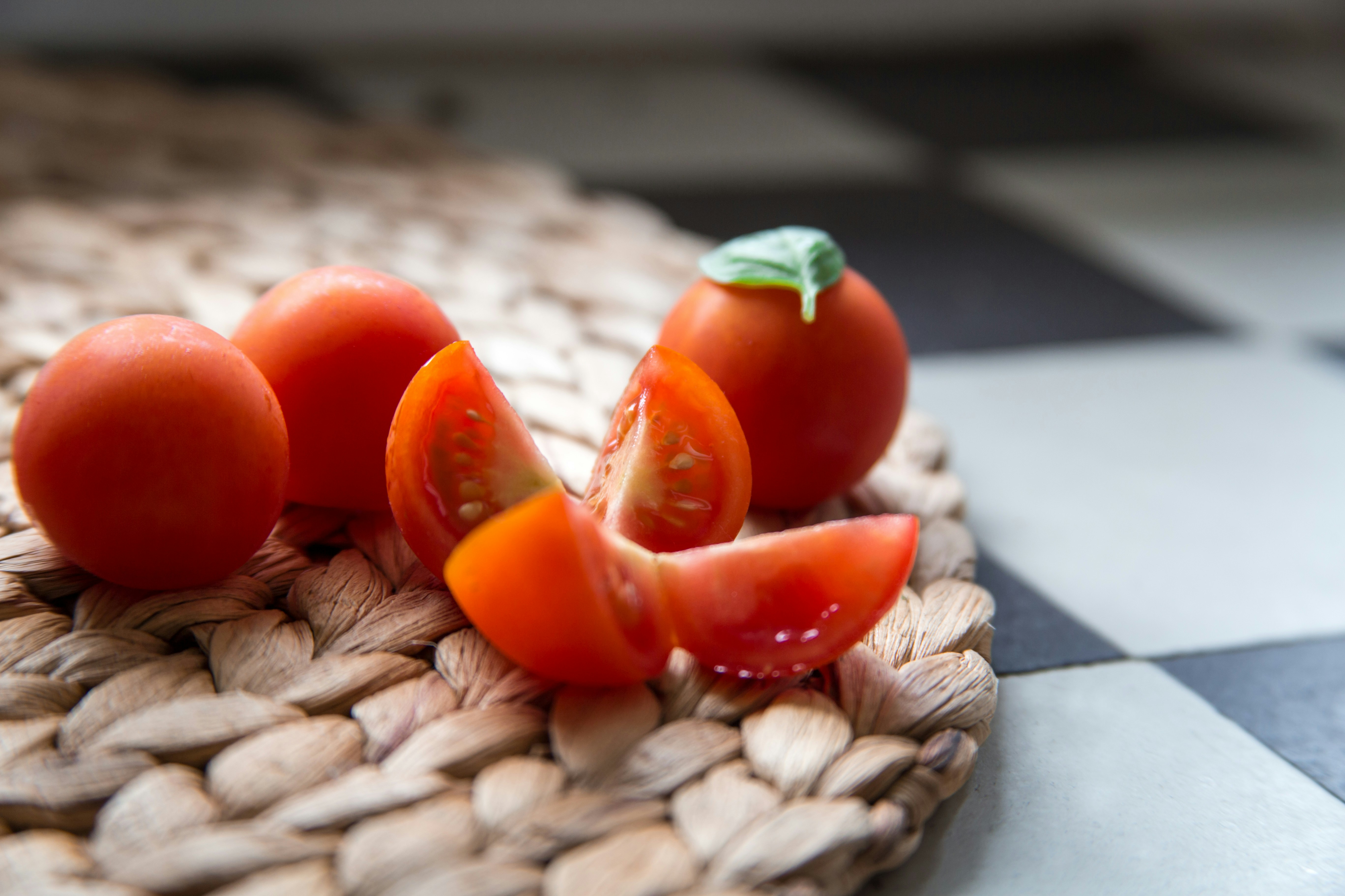 Tiny Sunlit Tomatoes on a Woven Canvas