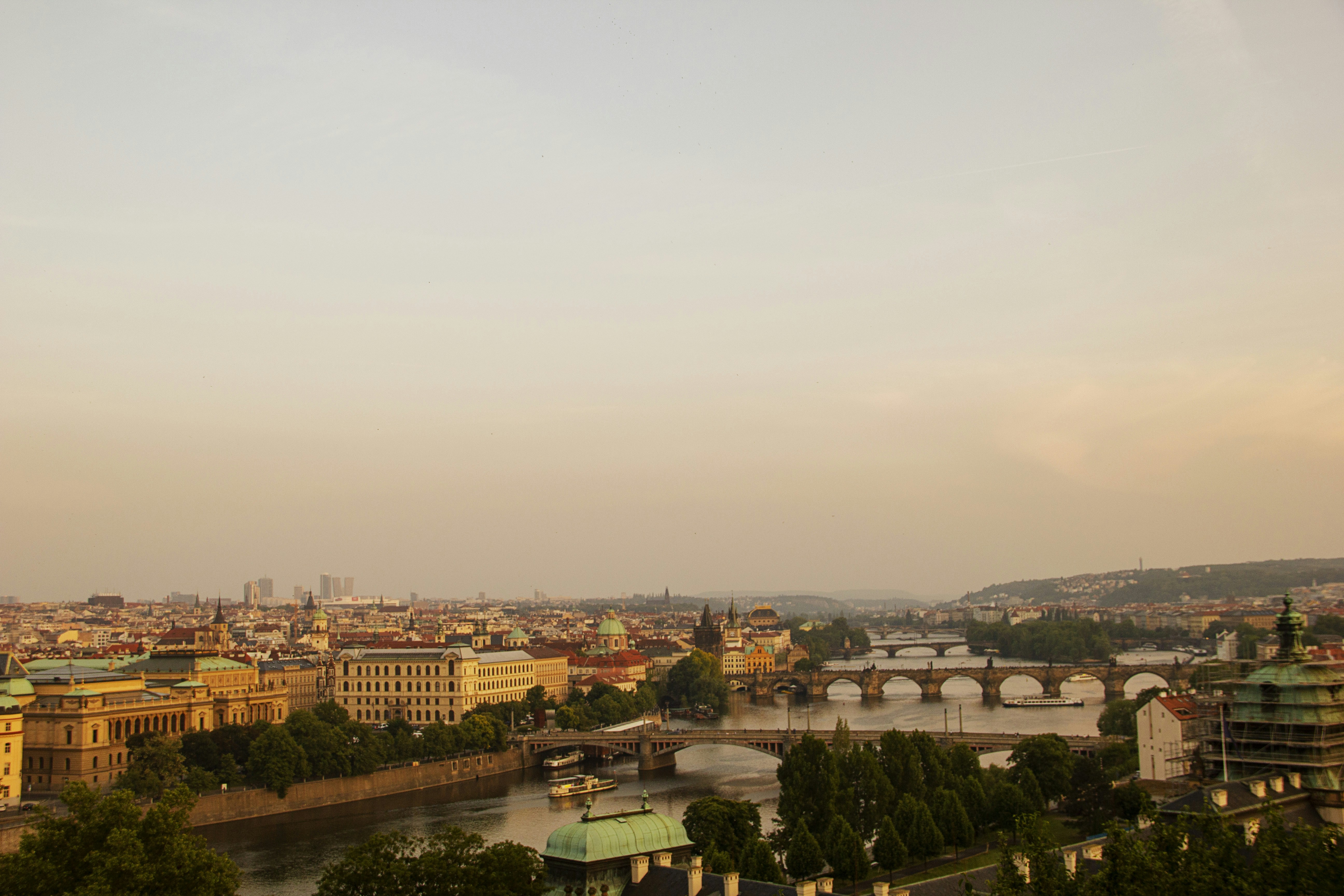 Golden Dusk Over the Vltava: Bridges Linking a Quiet City Panorama