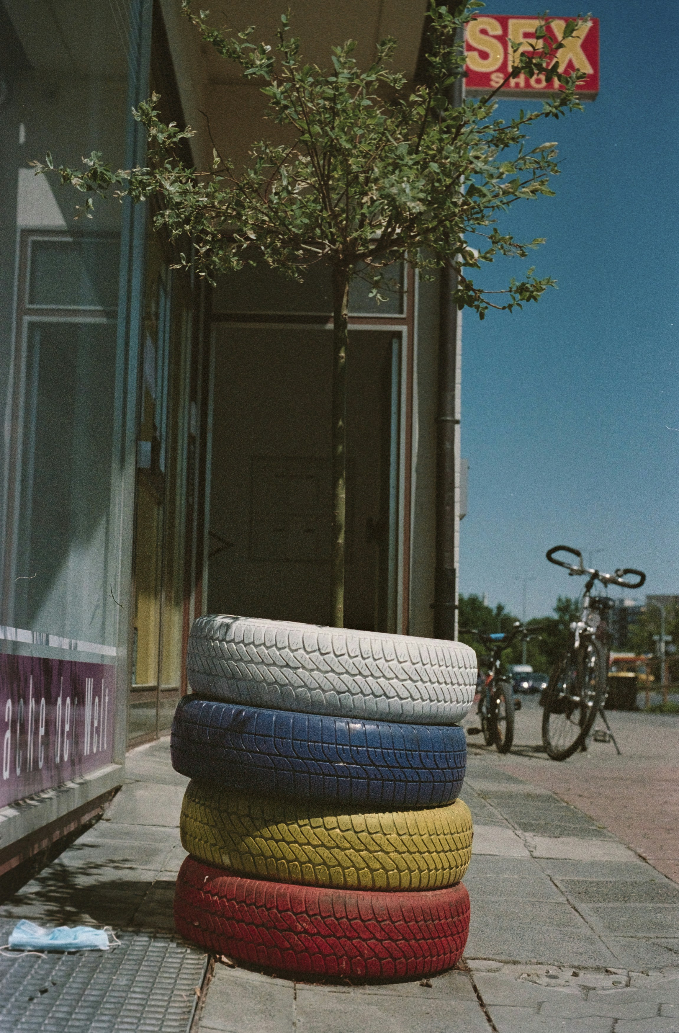 Colorstacked Tires on a Quiet City Sidewalk