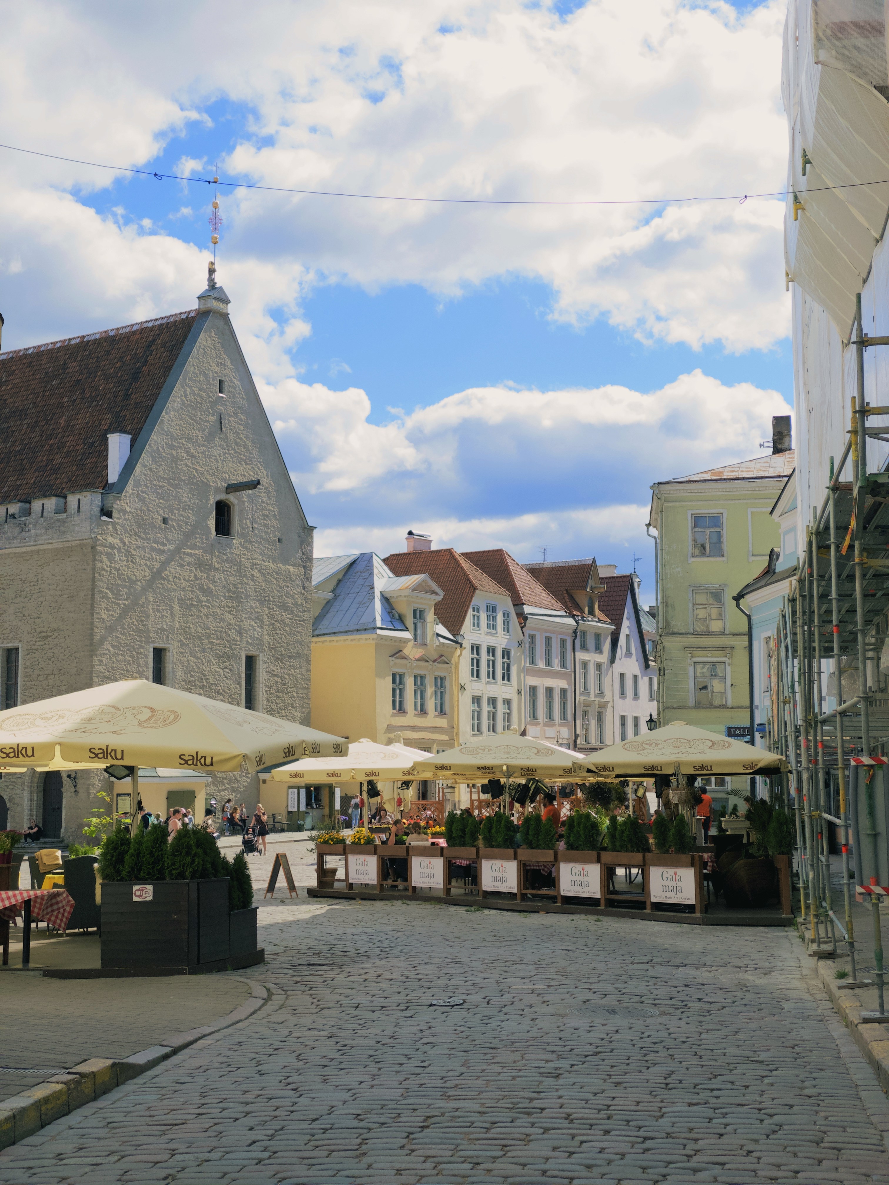 Cobbled Street Café Under a Bright Nordic Sky