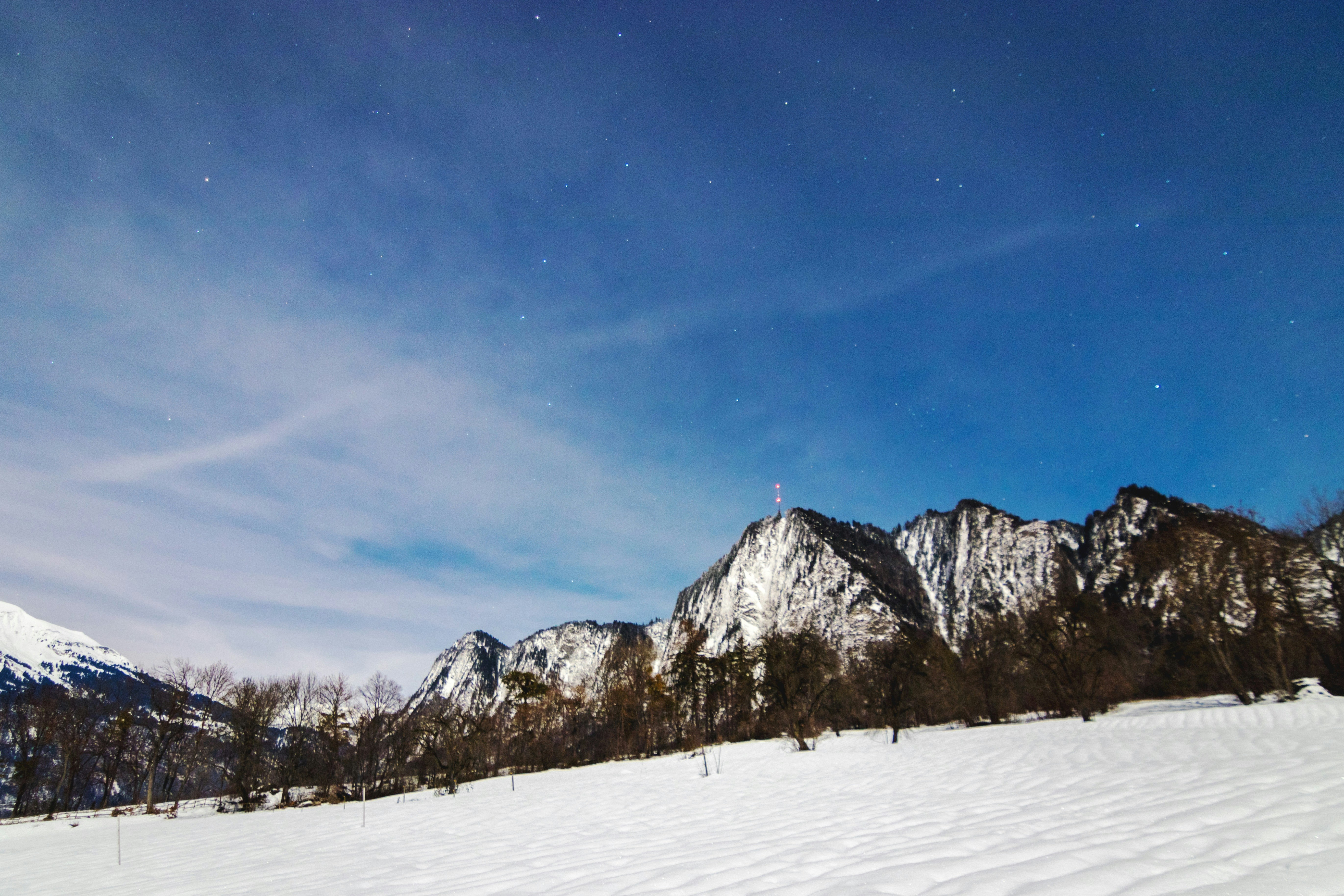 Snow covered mountain under blue sky during daytime photo – Free Zizers ...