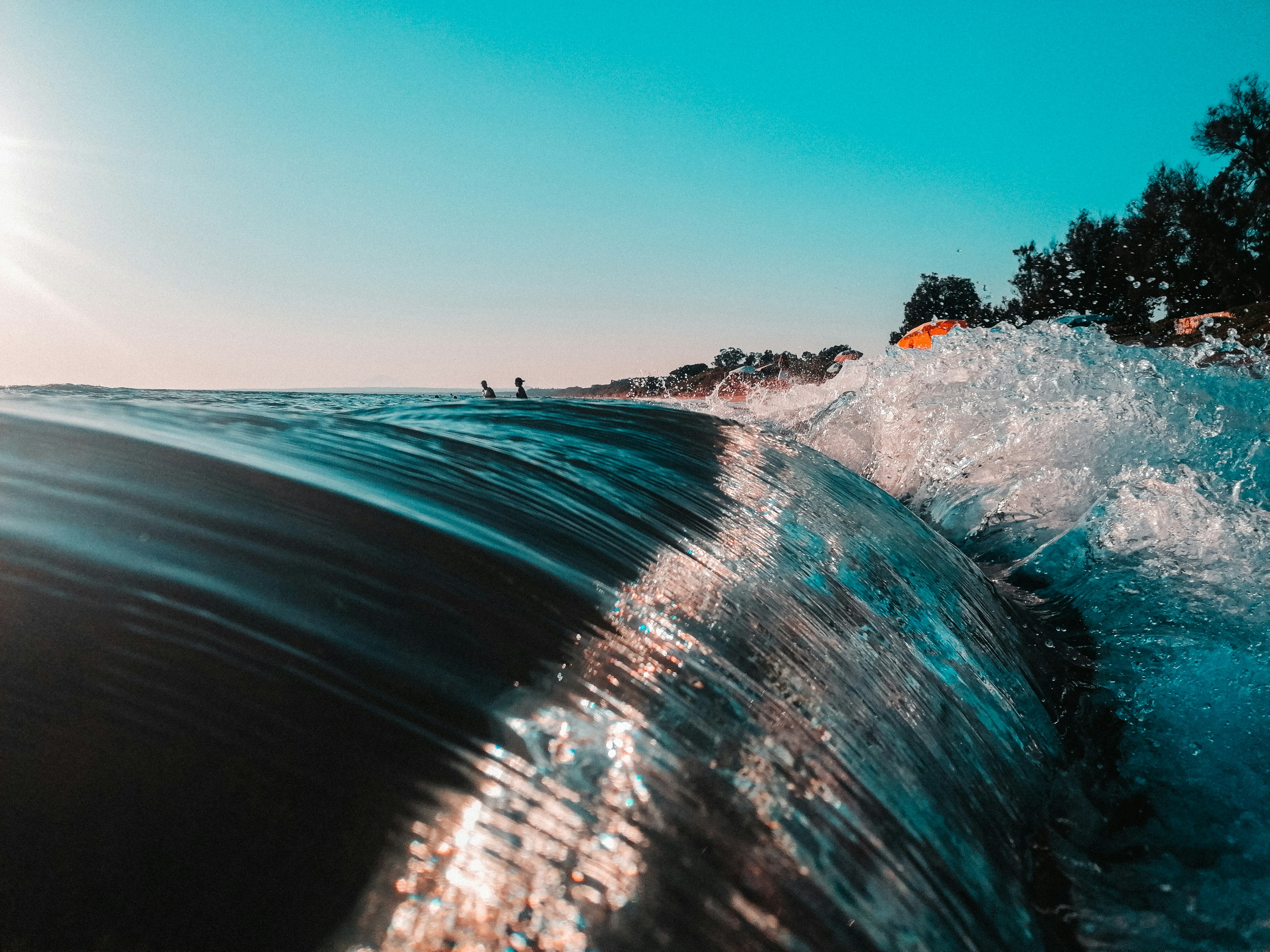 person surfing on sea waves during daytime