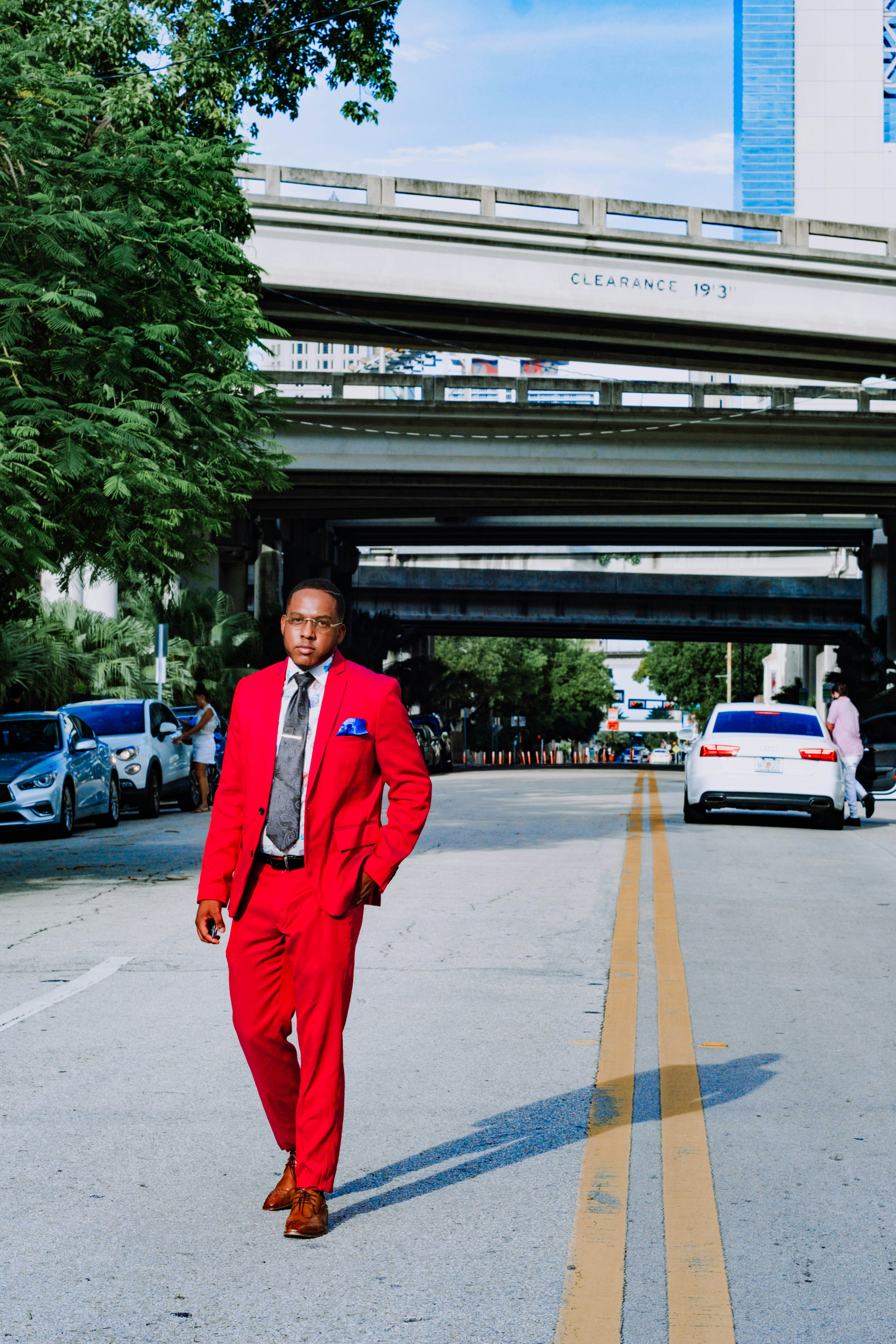 Crimson Suit Under the City Overpass