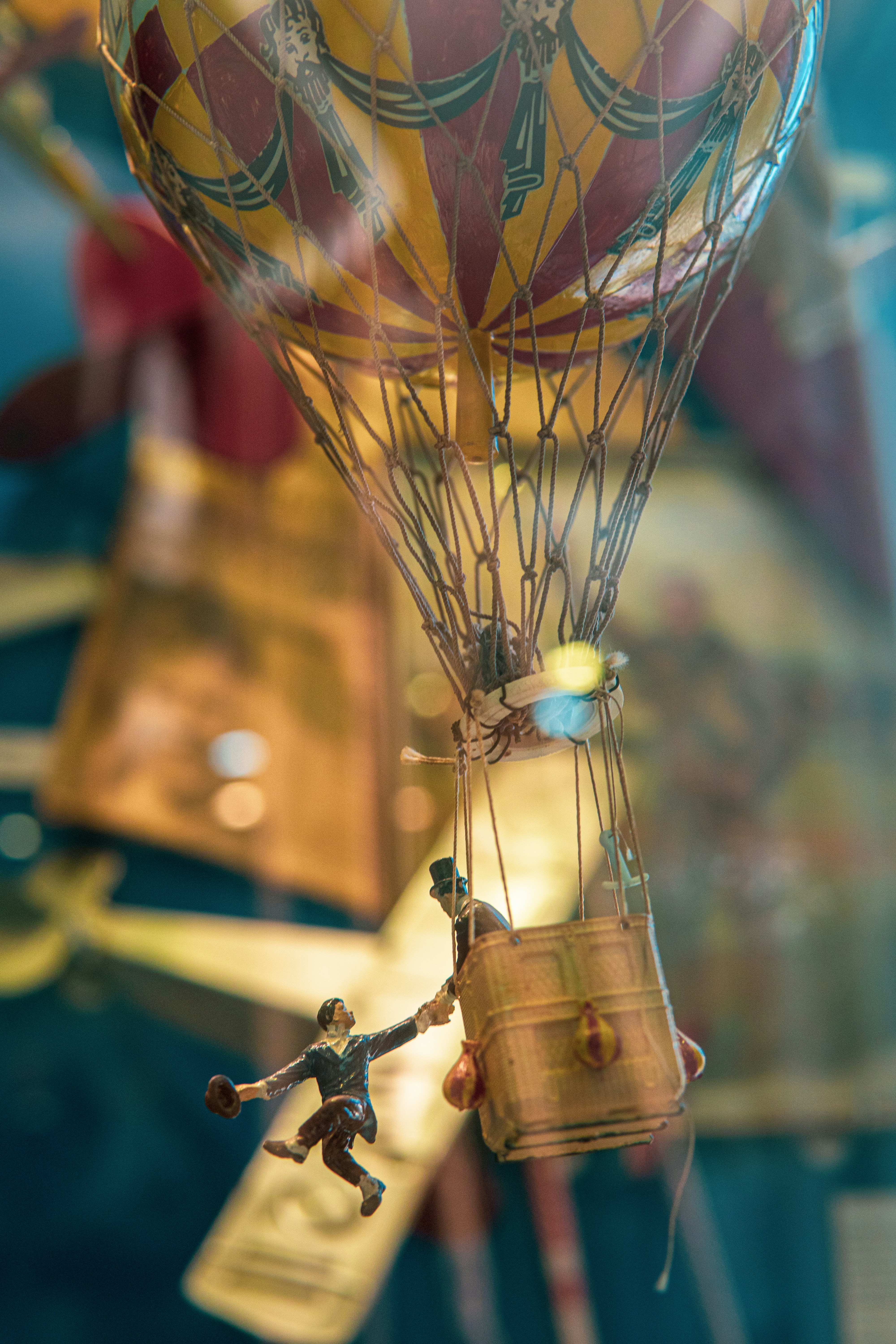Tiny Figure Afloat: A Delicate Balloon Flight Through Strings