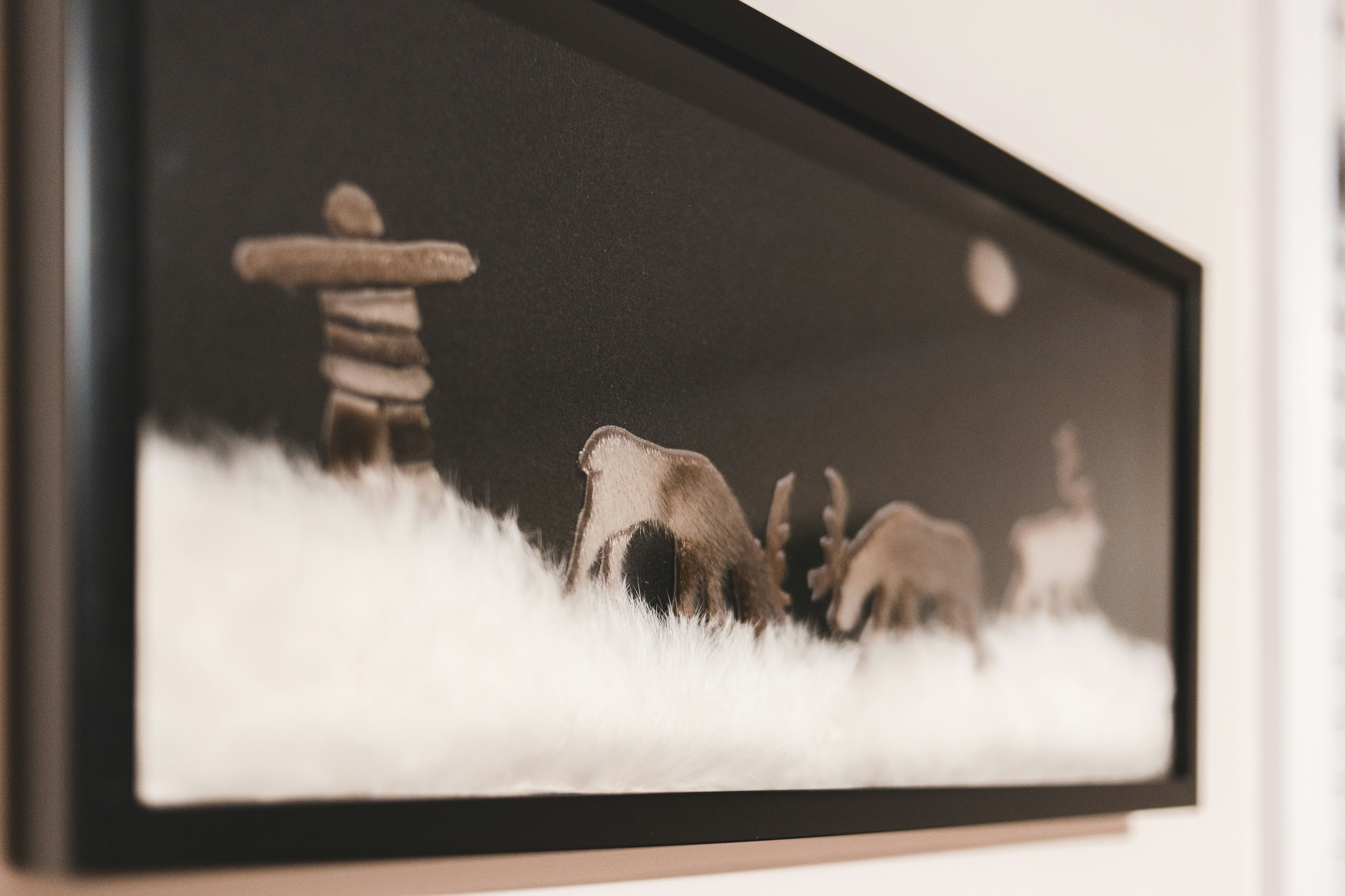 Monochrome Cairn: A Framed Snow-Field Diorama